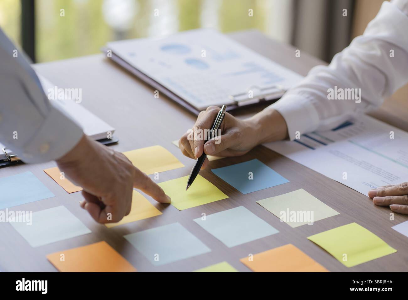 Business People brainstorming Meeting Design Ideas use post it notes to ...