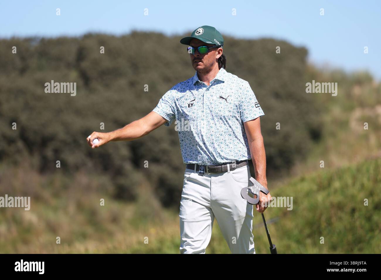 US golfer Rickie Fowler lines up a putt on the 6th green during a ...