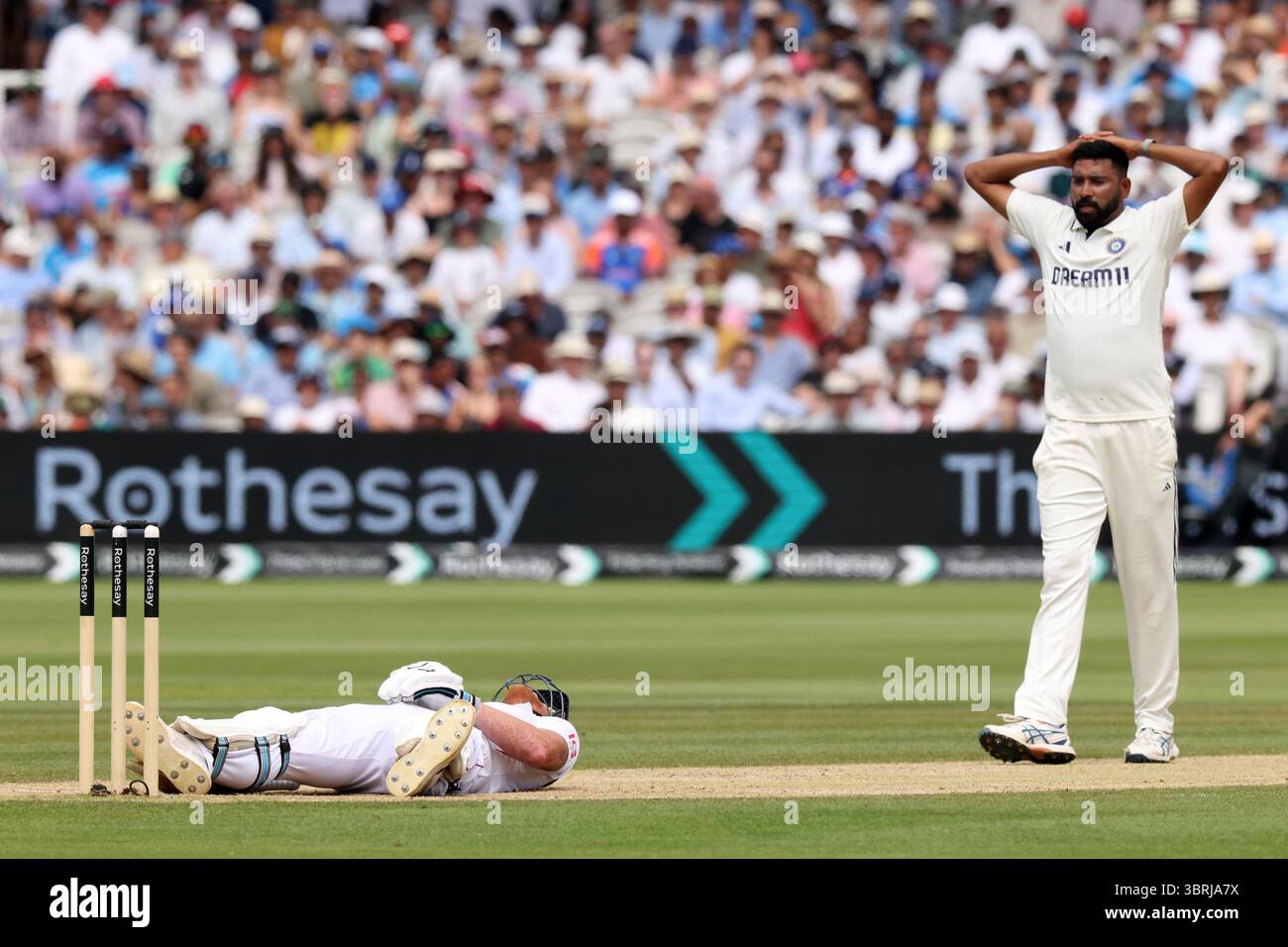 England's captain Ben Stokes lies on ground after a delivery from India ...