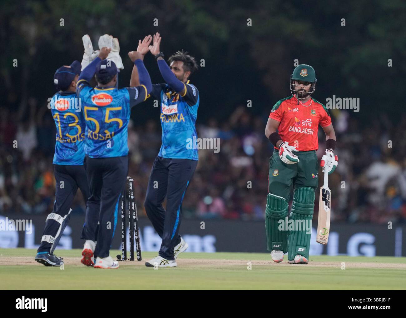 Bangladesh's Parvez Hossain Emon leaves the ground after losing his ...