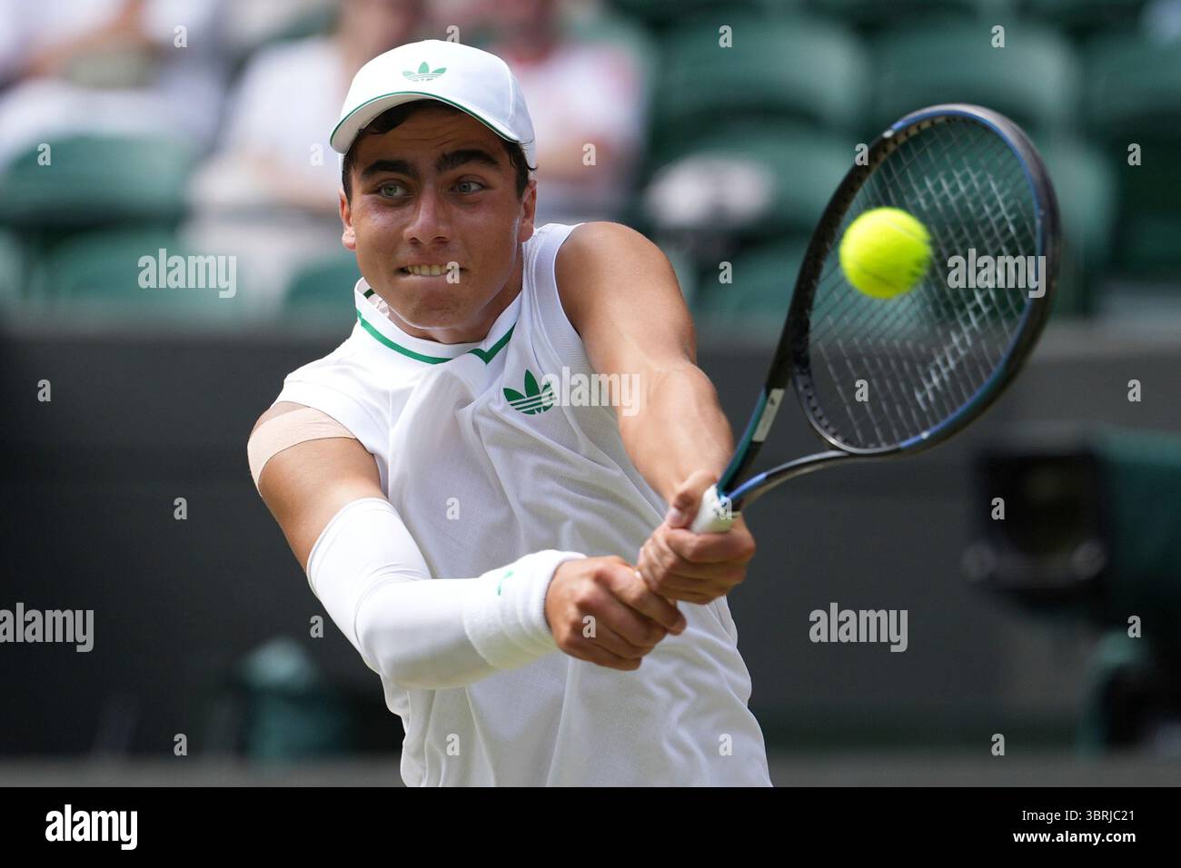 Ivan Ivanov of Bulgaria returns to Ronit Karki of the U.S. in the boys ...