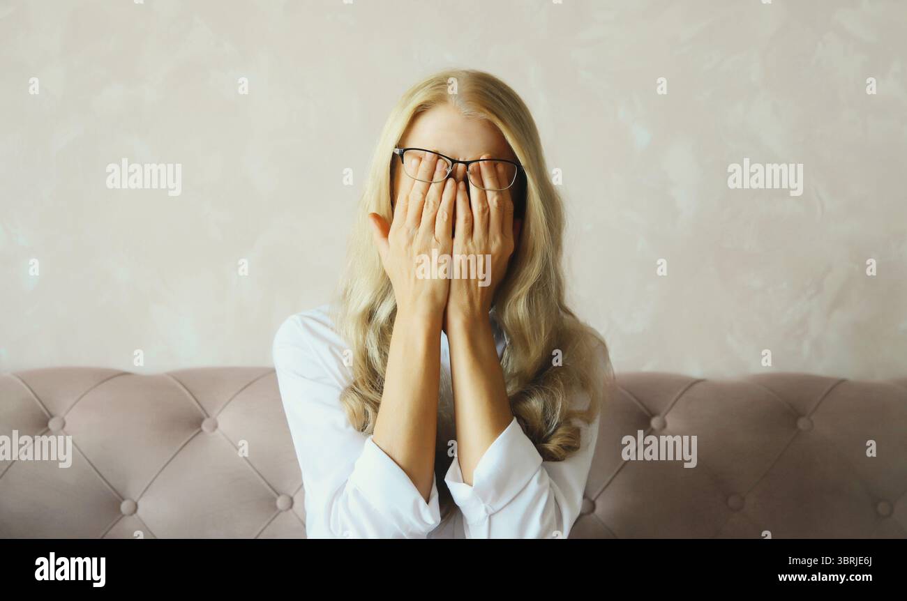 Tired overworked woman employee rubbing her eyes suffering from eye ...