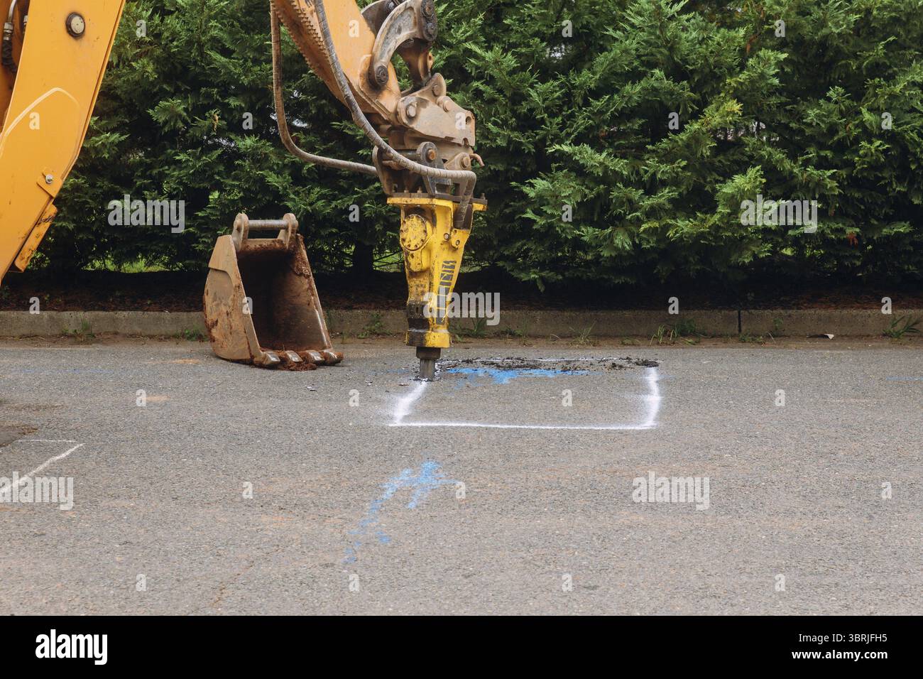 Construction worker repairing road with operating digger Jackhammer ...