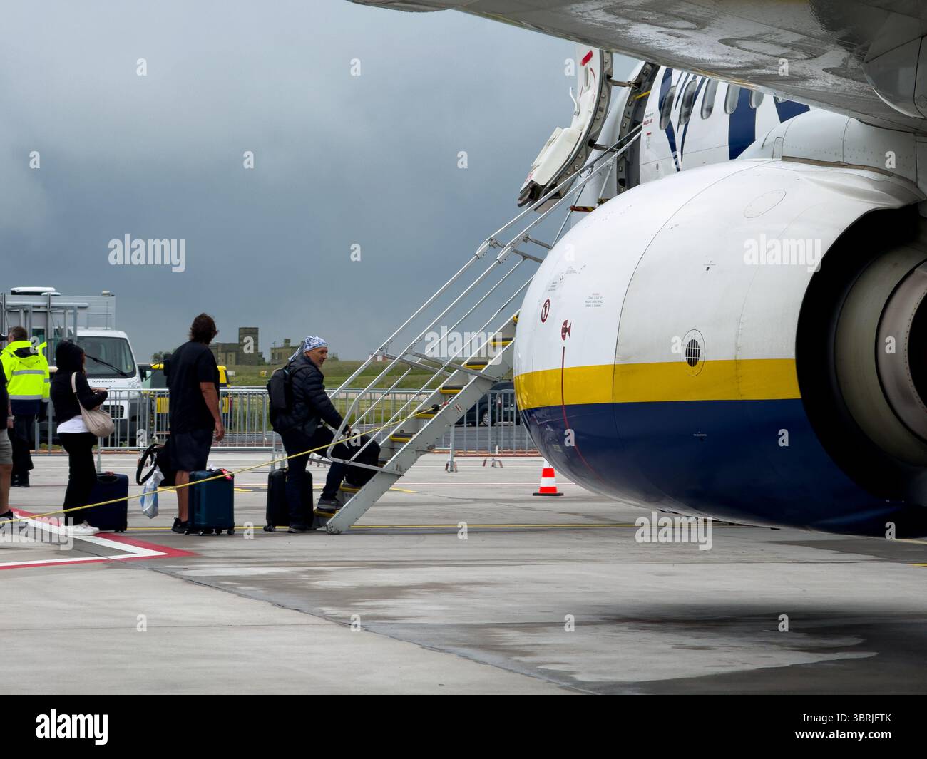 HAHN, GERMANY - JUNE 1, 2025 - Passengers boarding Ryanair airplane ...