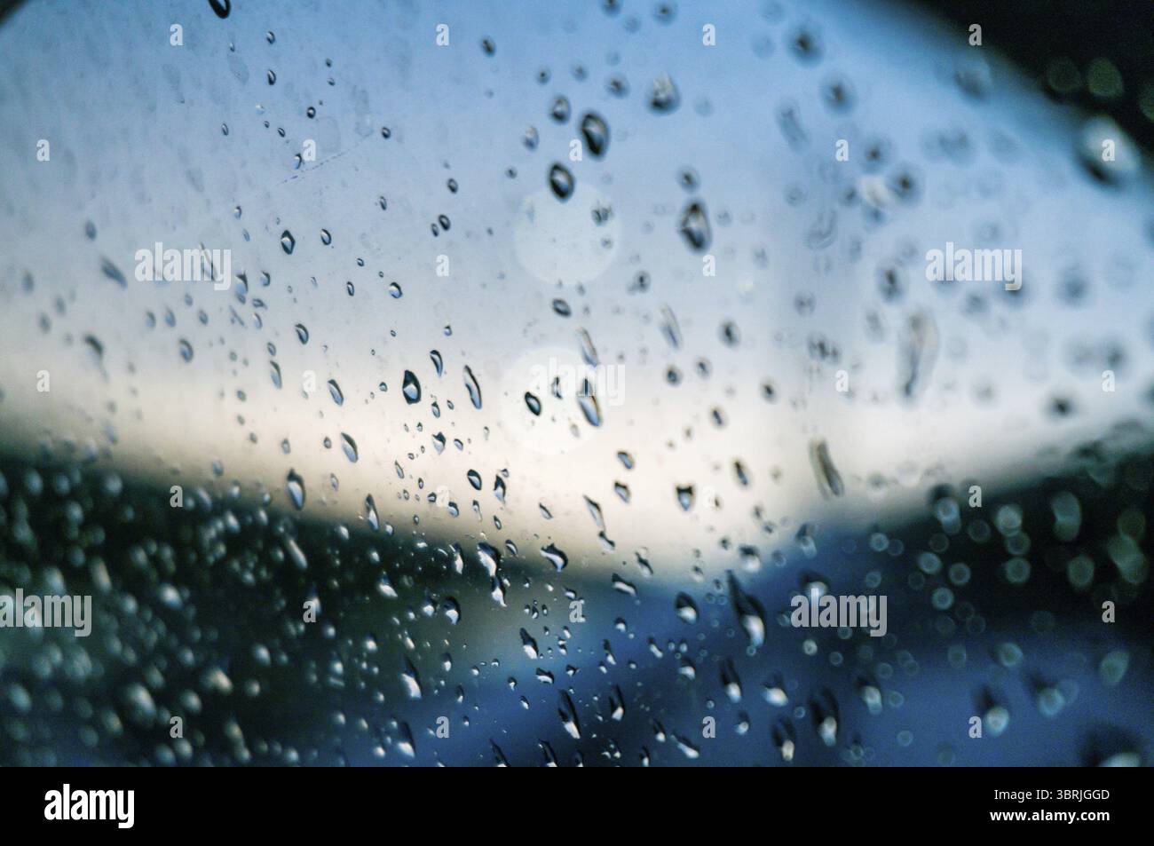 Rain drops on window glasses surface with sunset. drops on glass spray ...
