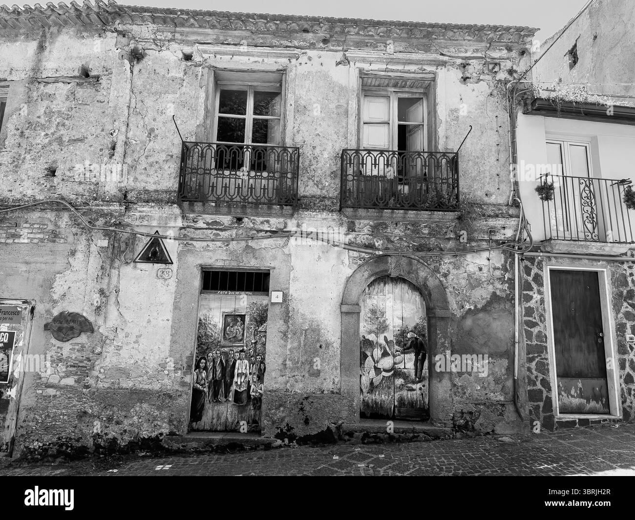 CALABRIA, ITALY - JUNE 4, 2025 - Old abandoned house with murals ...