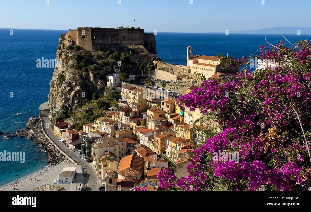 Purple bougainvillea flowers framing the colorful houses of Scilla ...