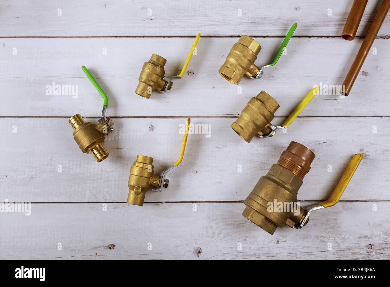 Plumbing gate ball vales, flexible water hose and fittings on a ...