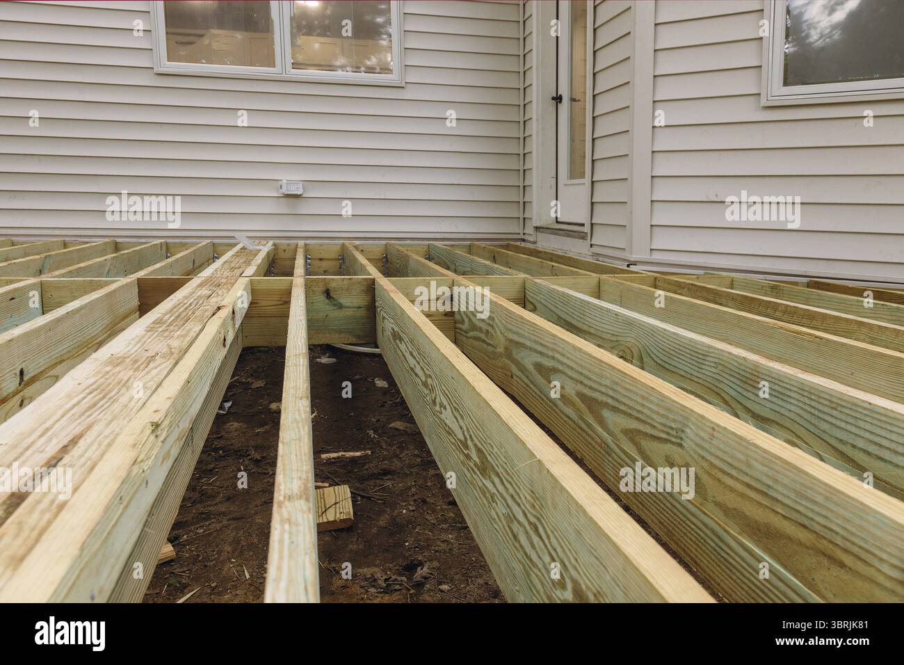 Installing deck patio construction. boards with above ground deck Stock Photo - Alamy