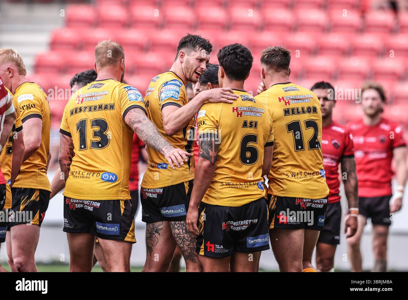 Eccles, UK. 13th July, 2025. Daejarn Asi of Castleford Tigers ...