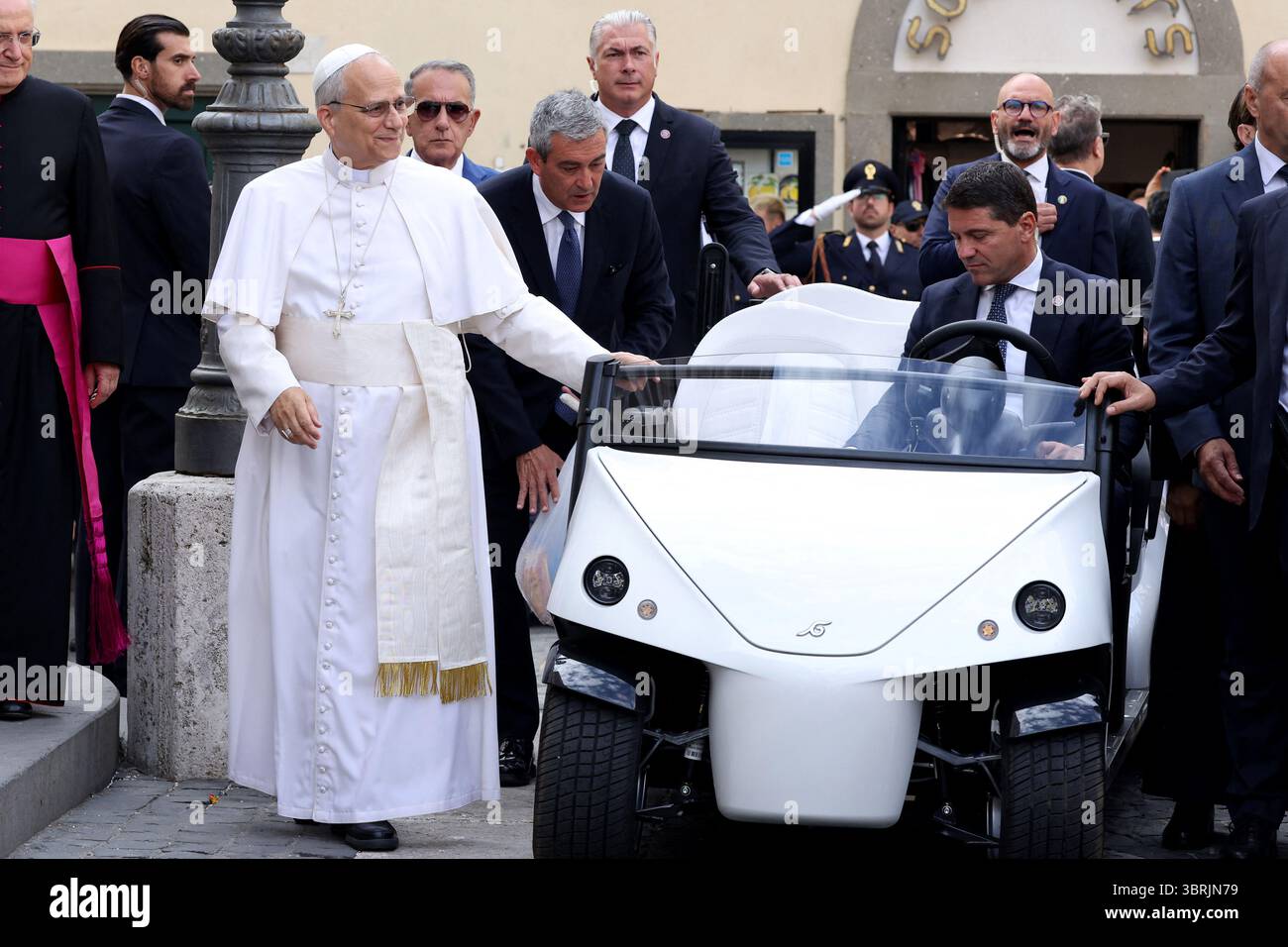 Pope Leo XIV arrives aboard a Golf cart at the Parish of St. Thomas of ...
