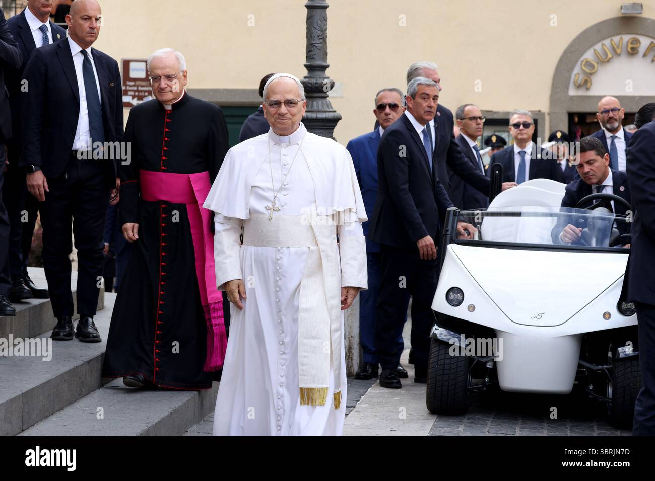 Pope Leo XIV arrives aboard a Golf cart at the Parish of St. Thomas of ...