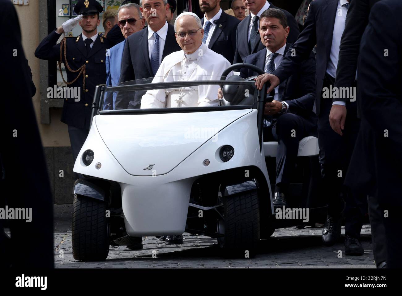 Pope Leo XIV arrives aboard a Golf cart at the Parish of St. Thomas of ...