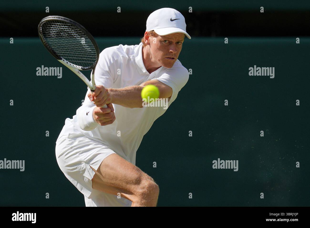 Italy's Jannik Sinner returns to Carlos Alcaraz of Spain in the men's ...