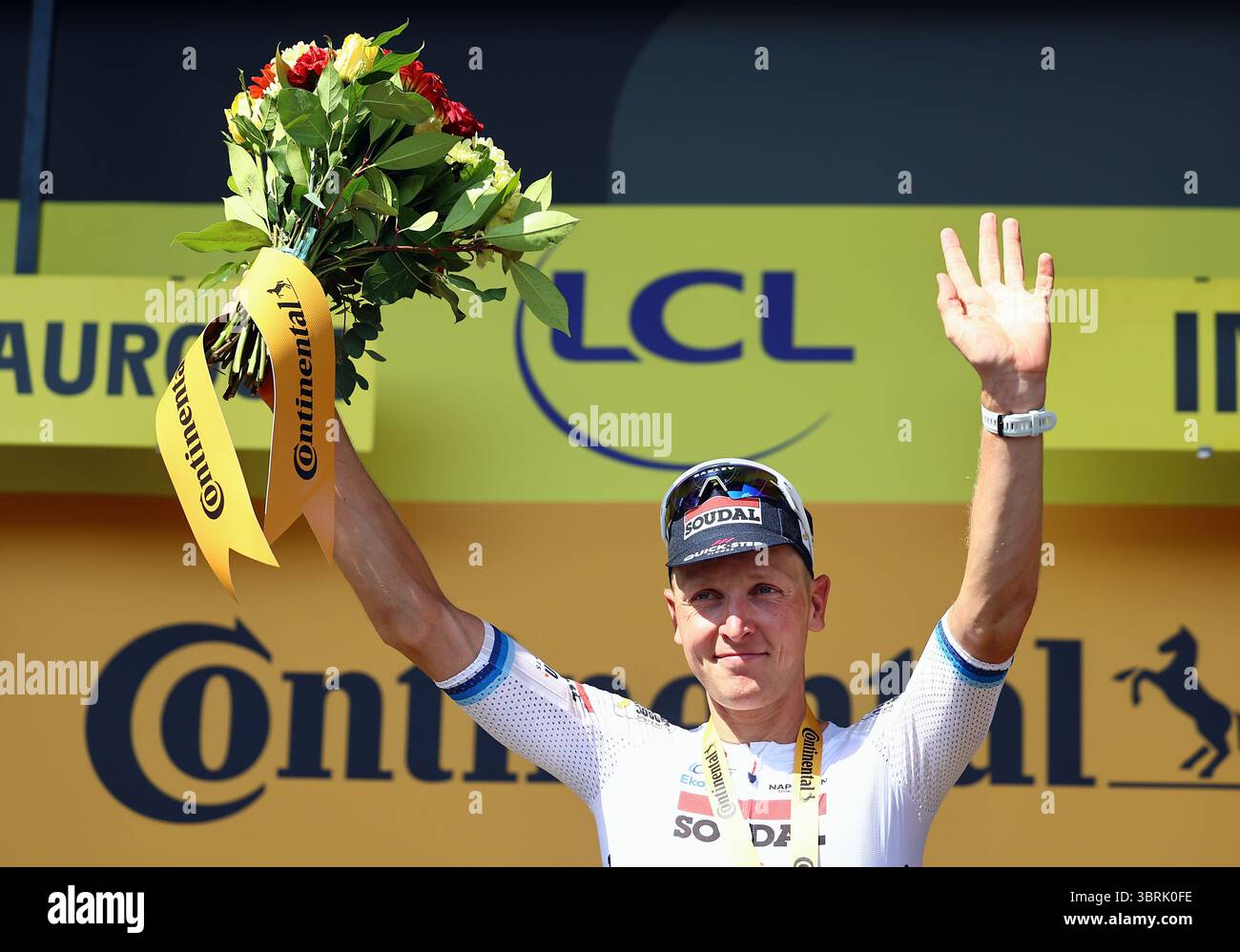 Belgian Tim Merlier of Soudal Quick-Step celebrates on the podium after ...
