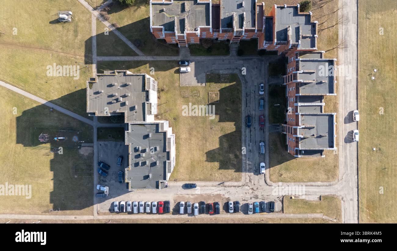Aerial view of a residential complex with multiple buildings, parking ...