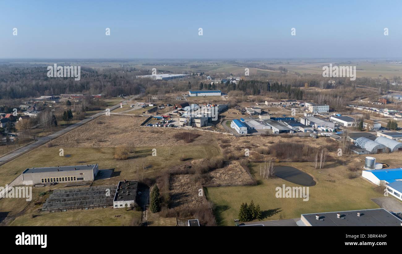 Aerial view of an industrial area with warehouses, factories, and open ...