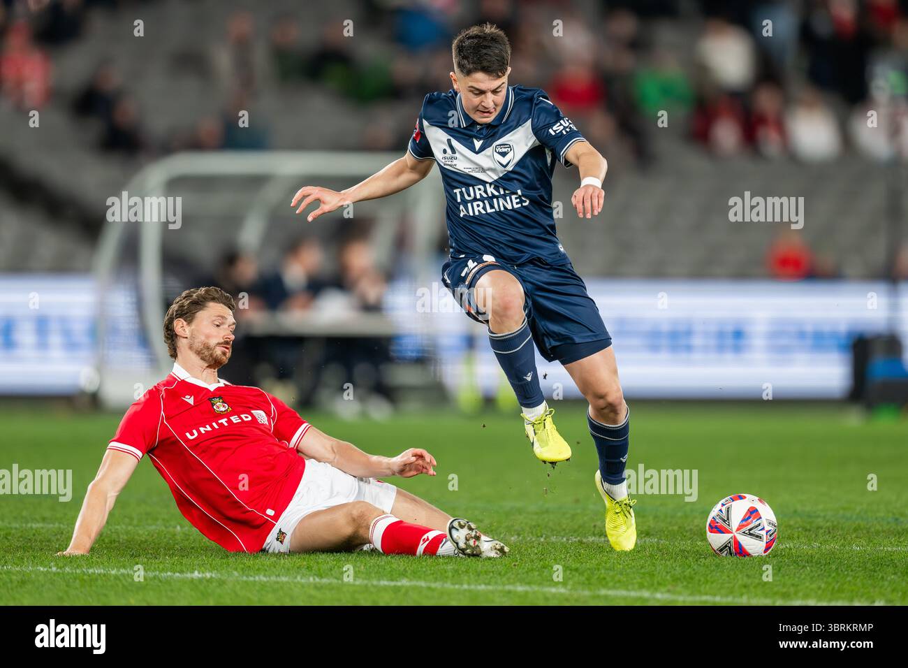 Jack Mihailidis of Melbourne Victory and George Evans of Wrexham AFC ...