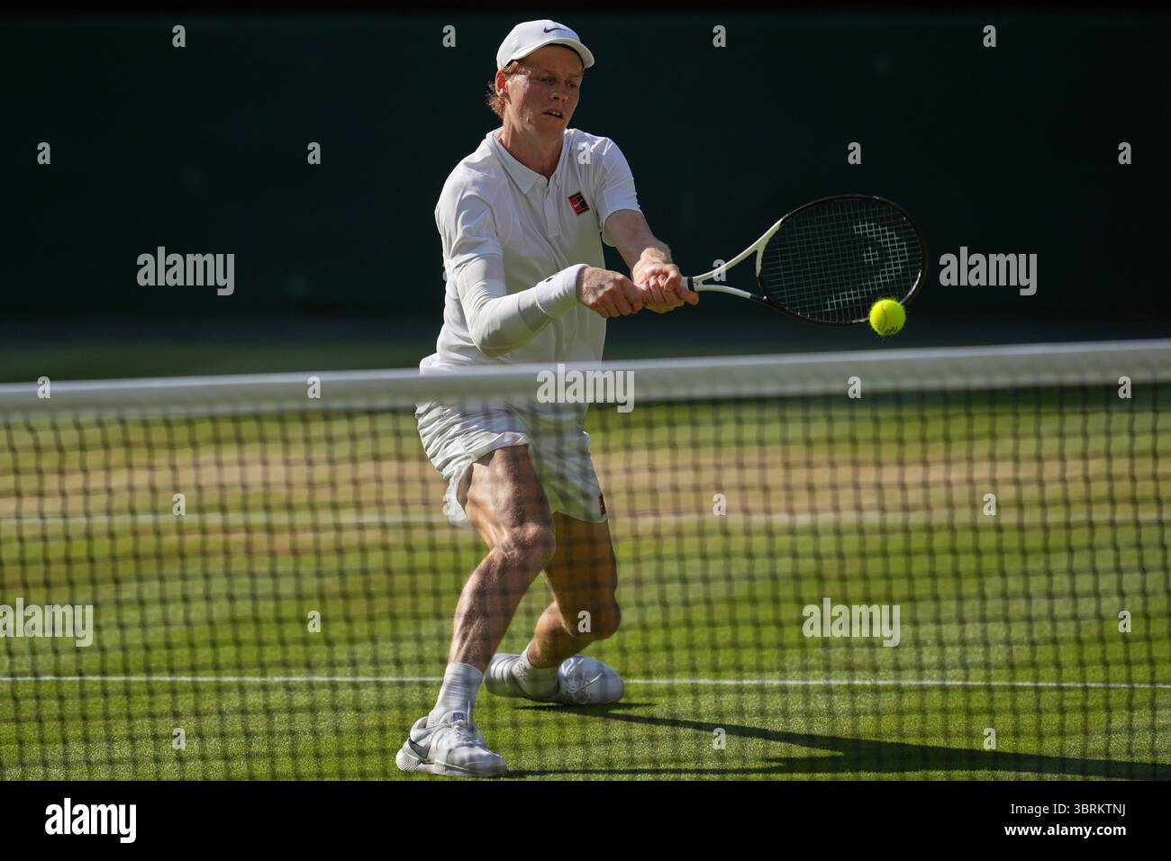 Italy's Jannik Sinner returns to Carlos Alcaraz of Spain in the men's ...