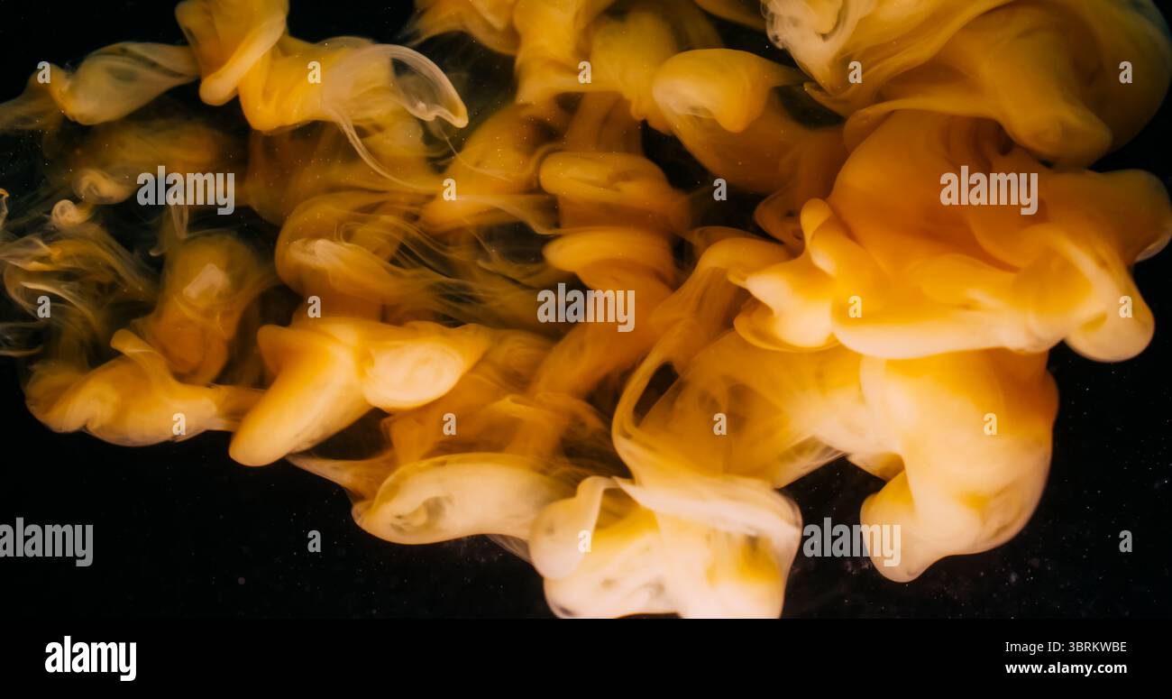 Paint vapor. Liquid pigment. Blur yellow color water smoke wave ...