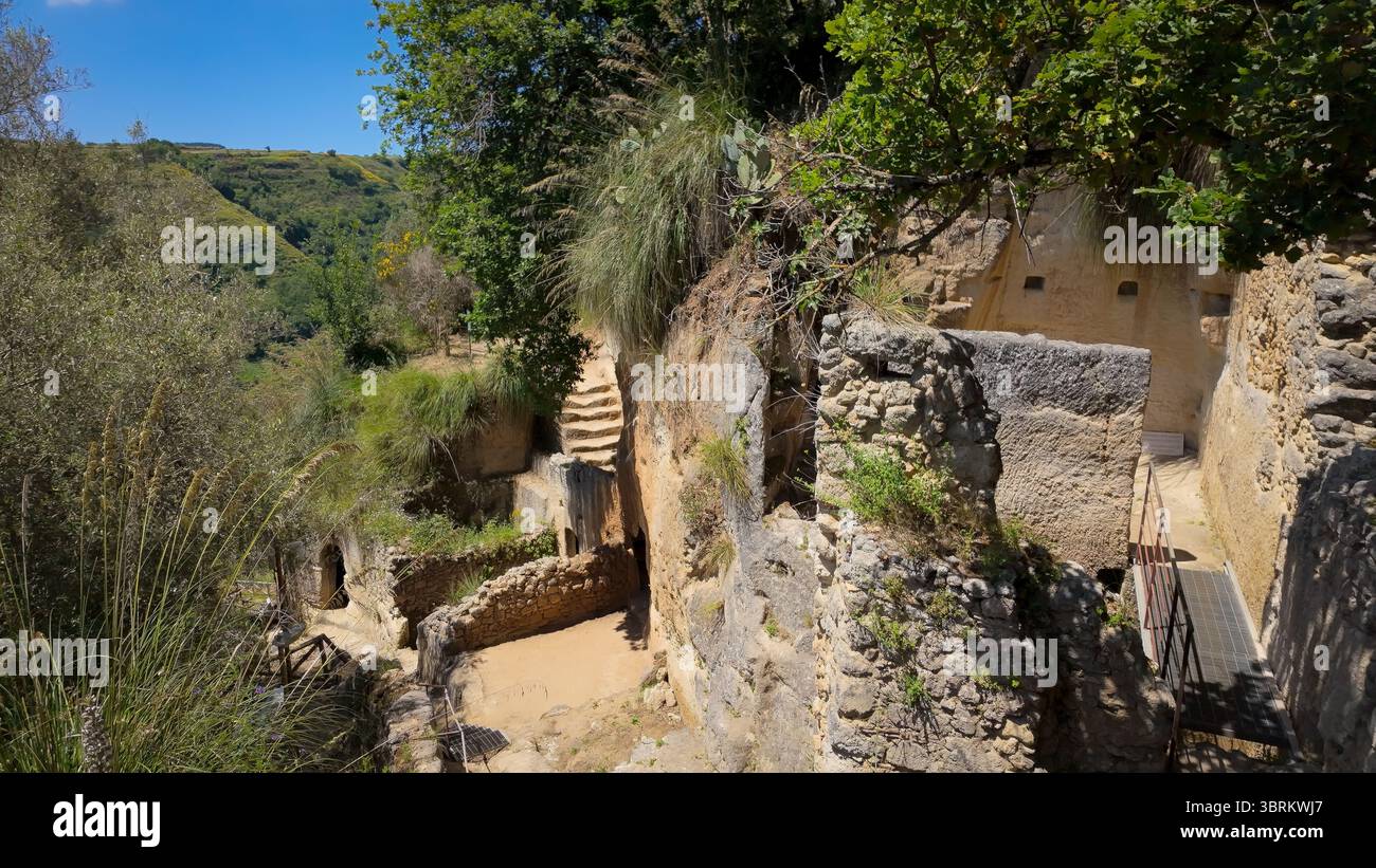Ancient rupestrian settlement carved into sandstone rock in Zungri ...