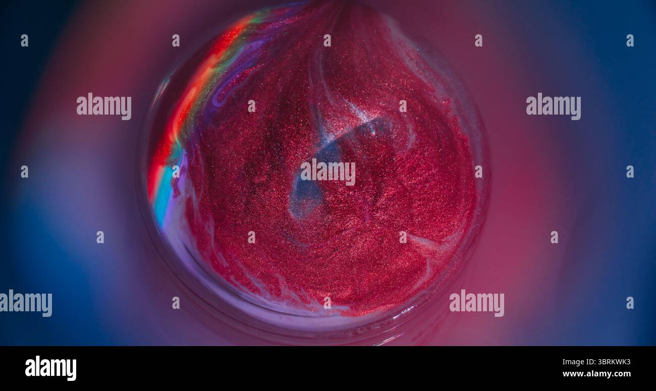 Light texture. Shiny ink. Defocused purple red green color round ...