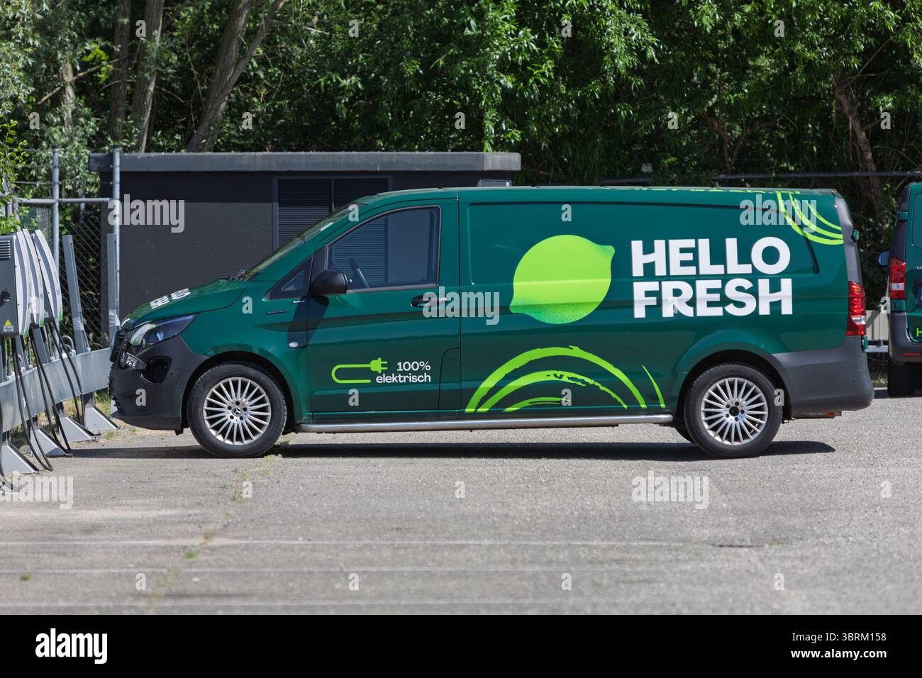 A vibrant green HelloFresh electric delivery van, featuring its logo ...
