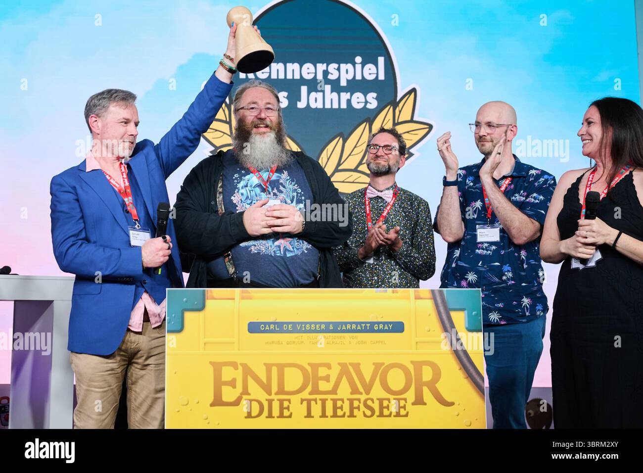 13 July 2025, Berlin: The designers of the game "Endeavor" Jarrett Gray ...