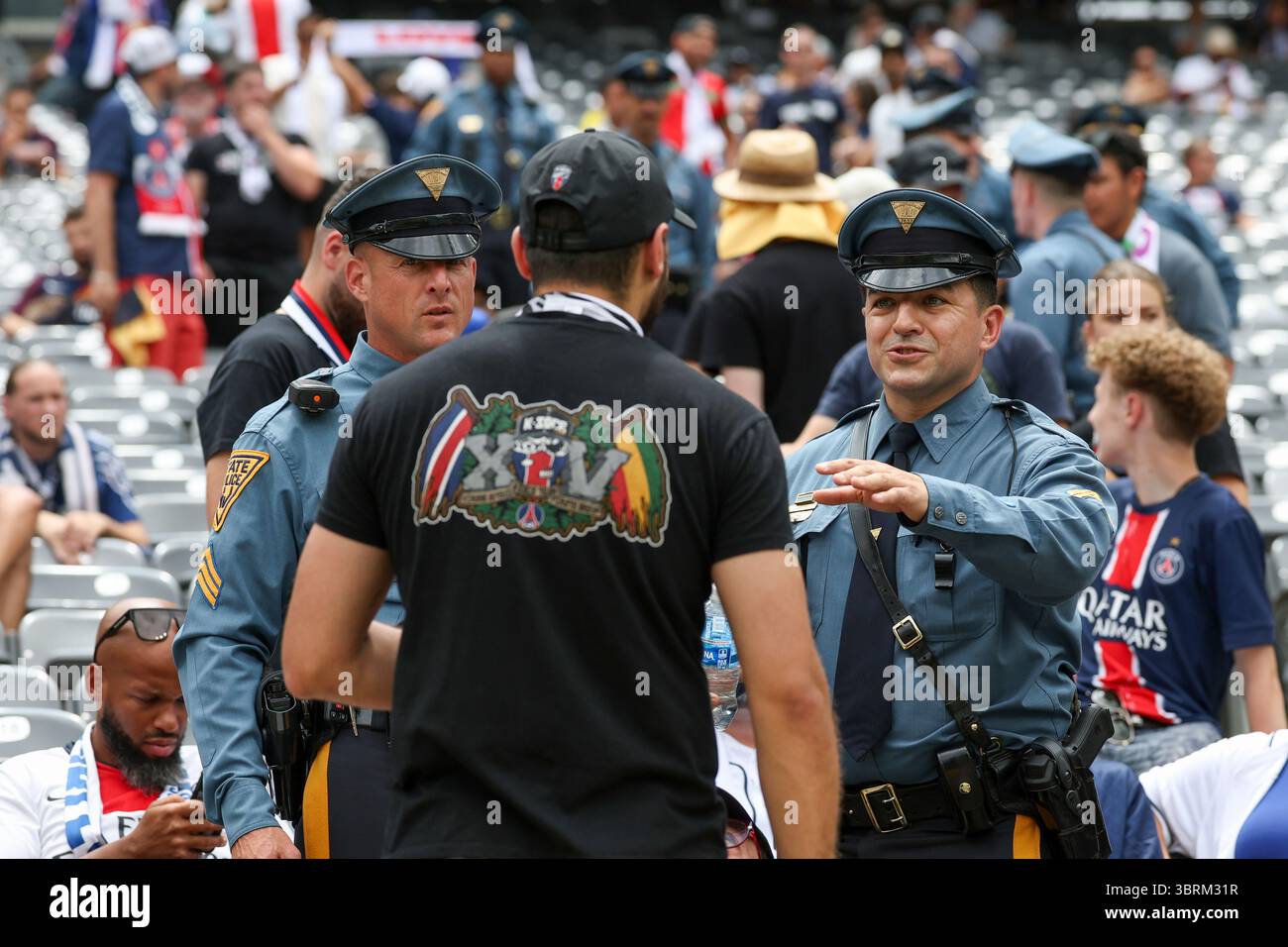 EAST RUTHERFORD, NJ - JULY 13: New Jersey State Police talk to fans ...