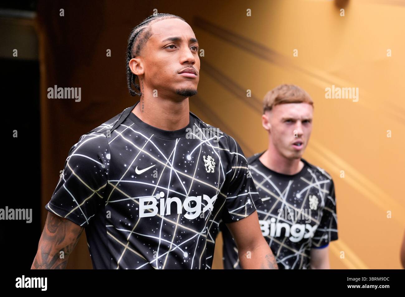 Chelsea's Joao Pedro, left, and Cole Palmer walk onto the pitch before ...
