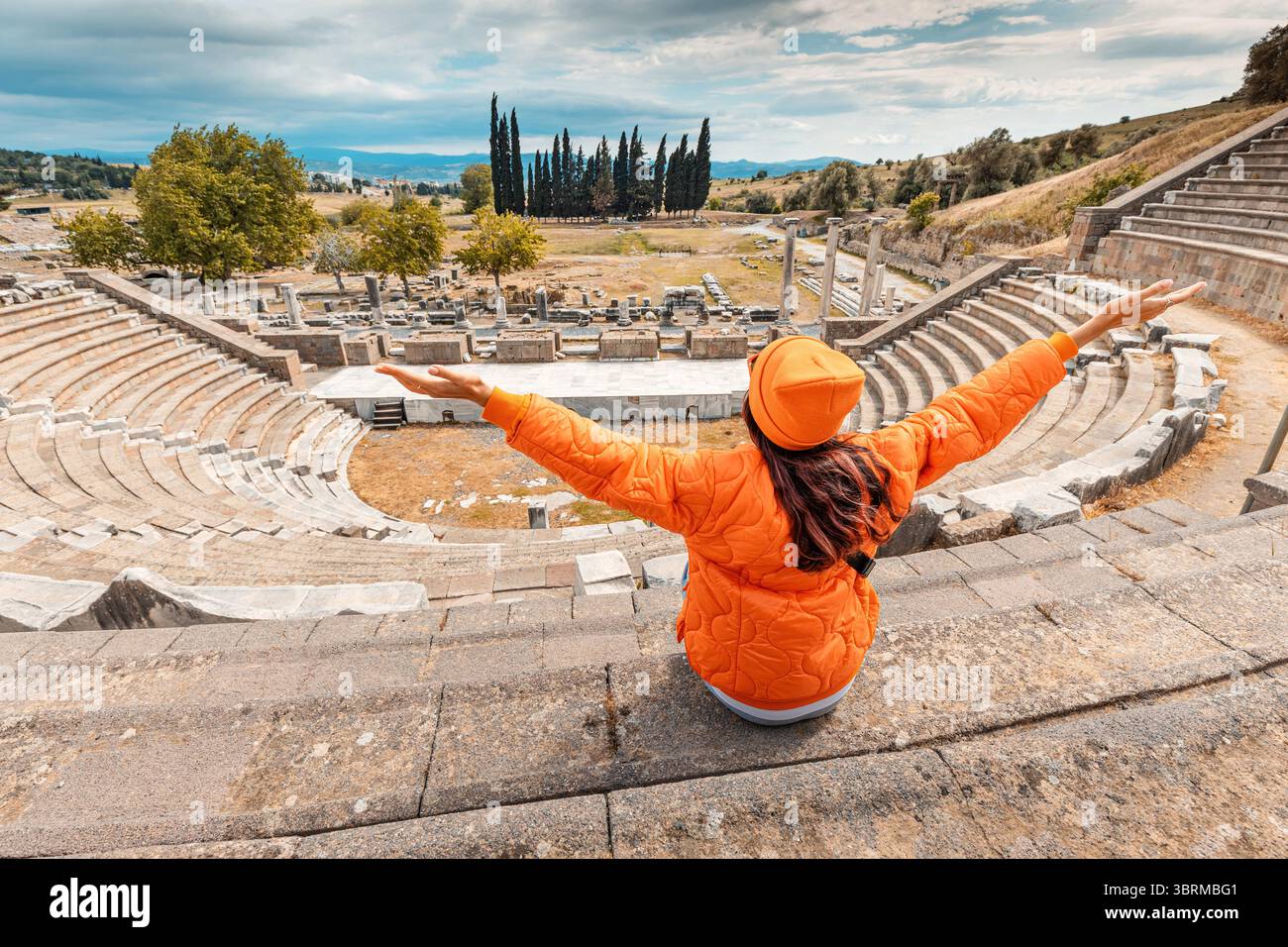 Tourist admiring the ancient Asklepion Theatre in Pergamon, Turkey, a ...