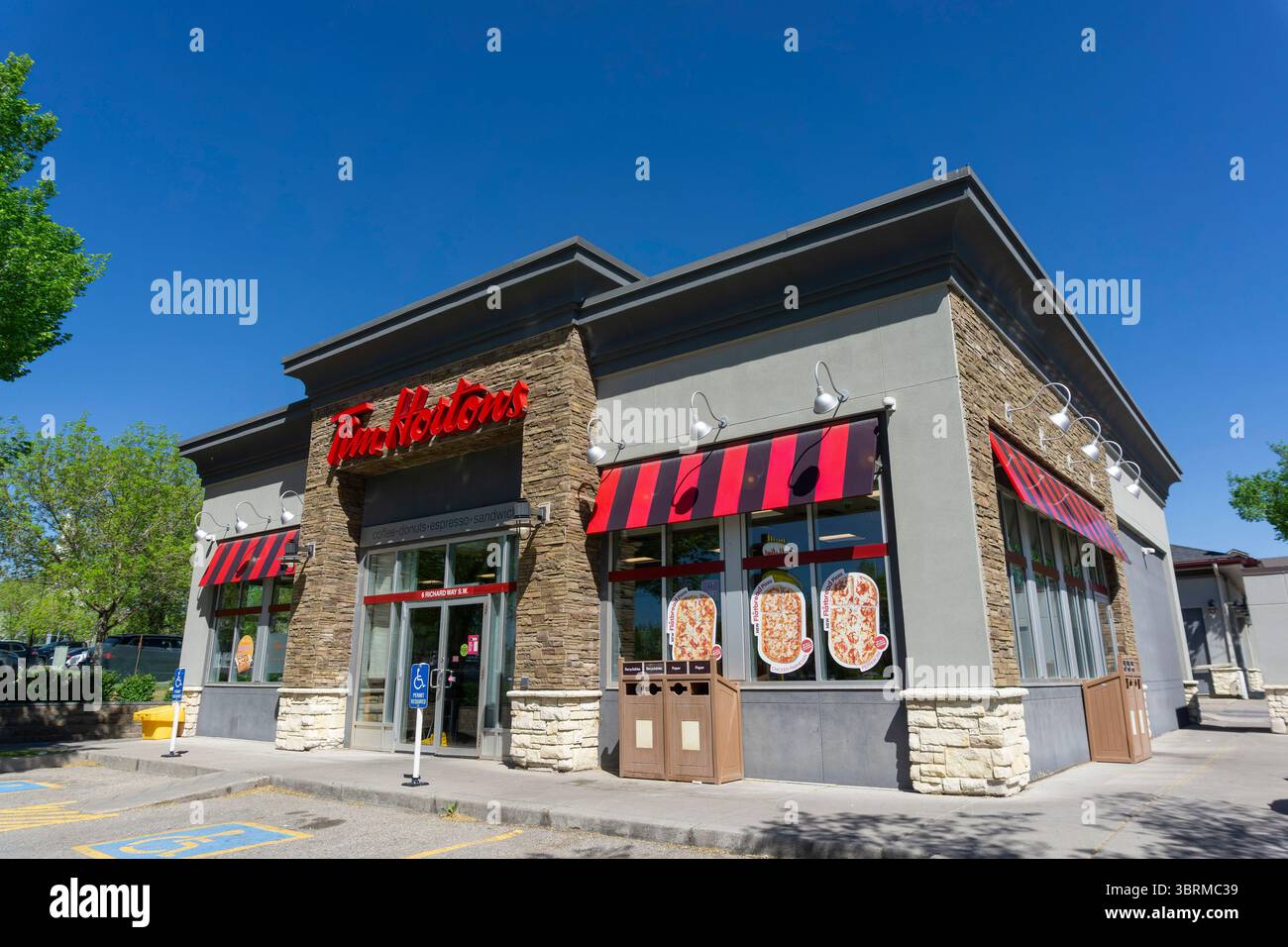 CALGARY, CANADA - MAY 30, 2025: Entrance of Tim Hortons, Canada's ...