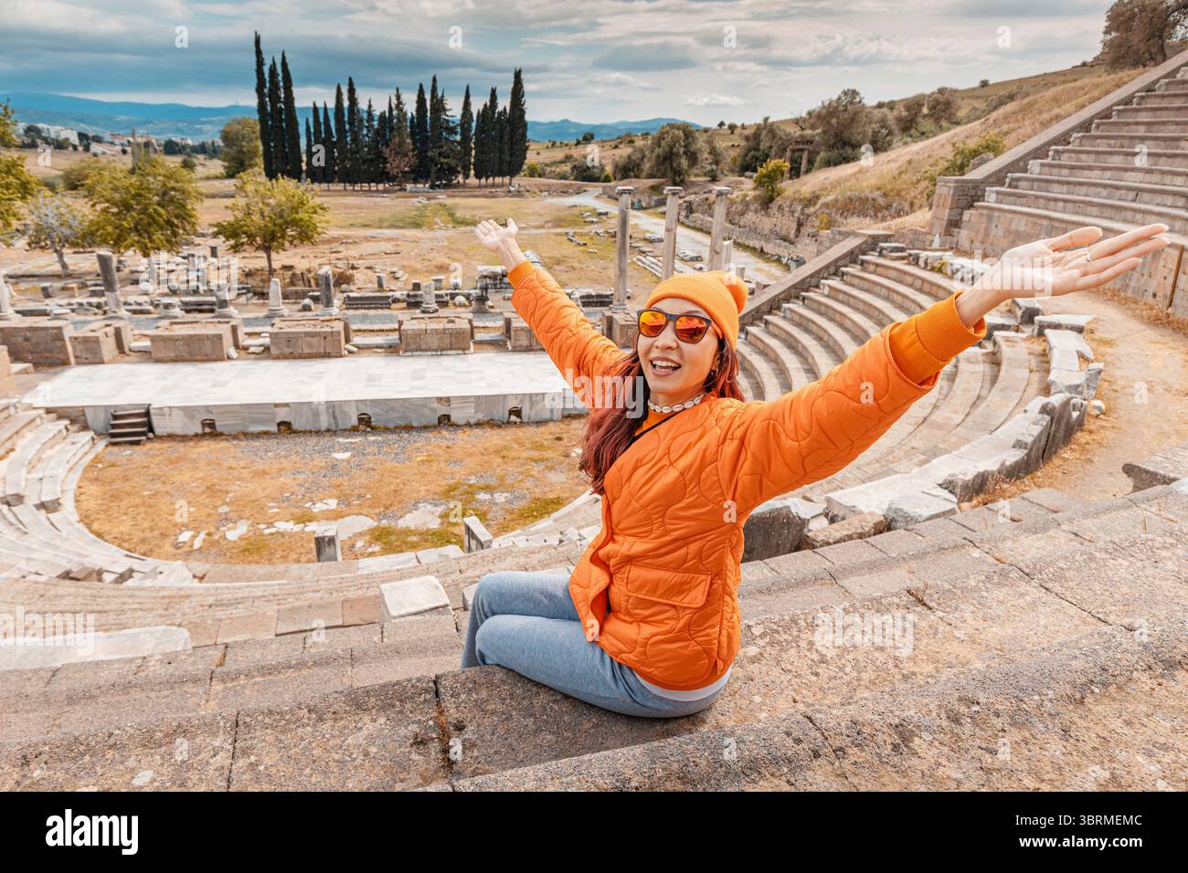 Tourist admiring the ancient Asklepion Theatre in Pergamon, Turkey, a ...