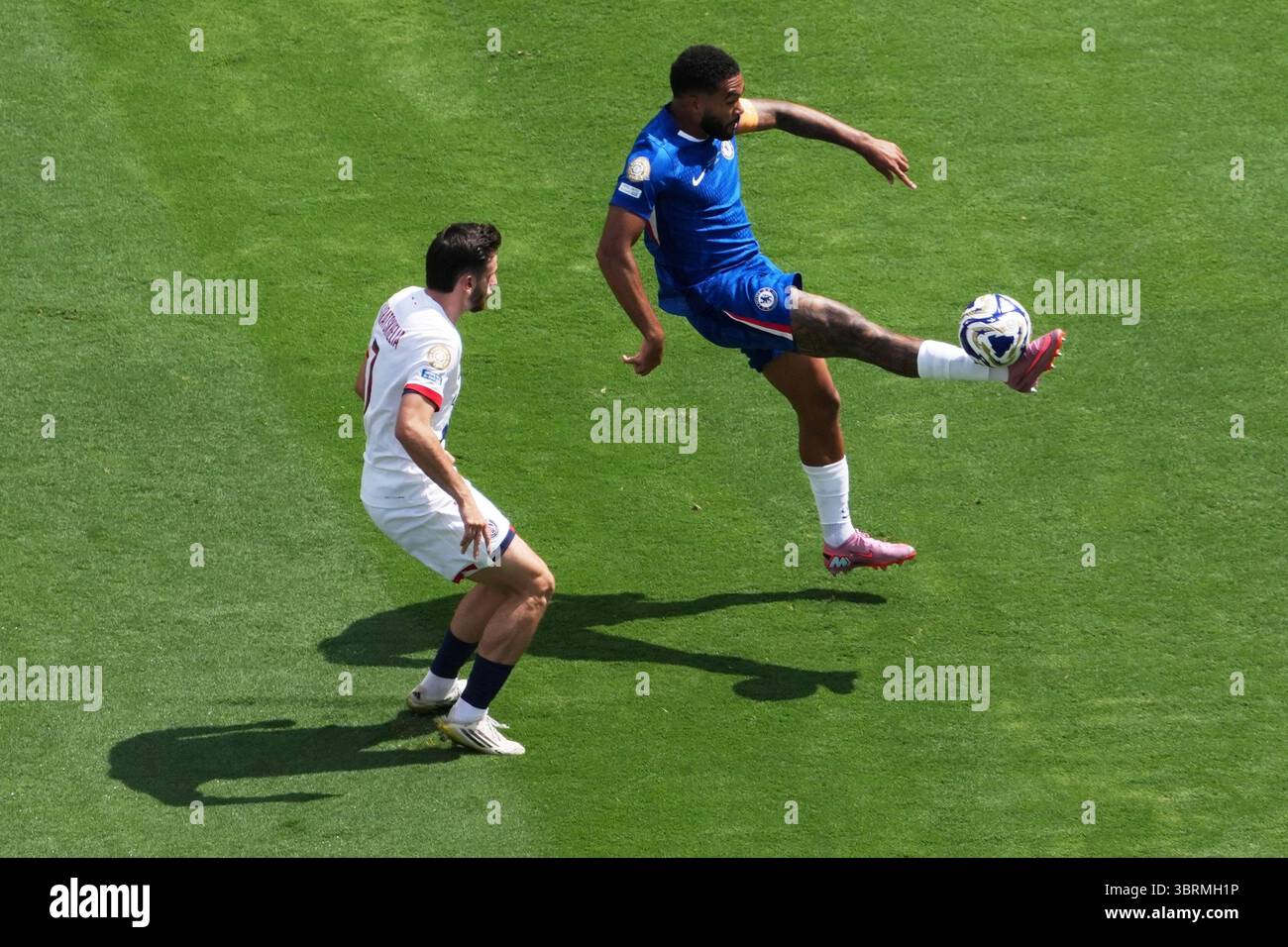 Chelsea's Reece James (24) kicks in front of Paris Saint-Germain's Khvicha Kvaratskhelia (7 ...