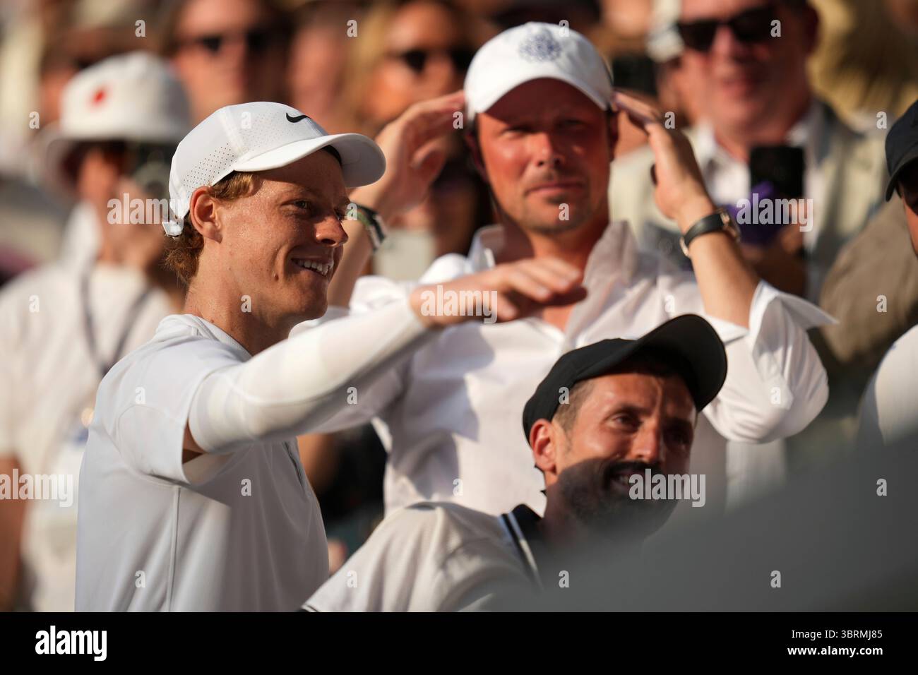 Italy's Jannik Sinner greets his team in the players box as he ...
