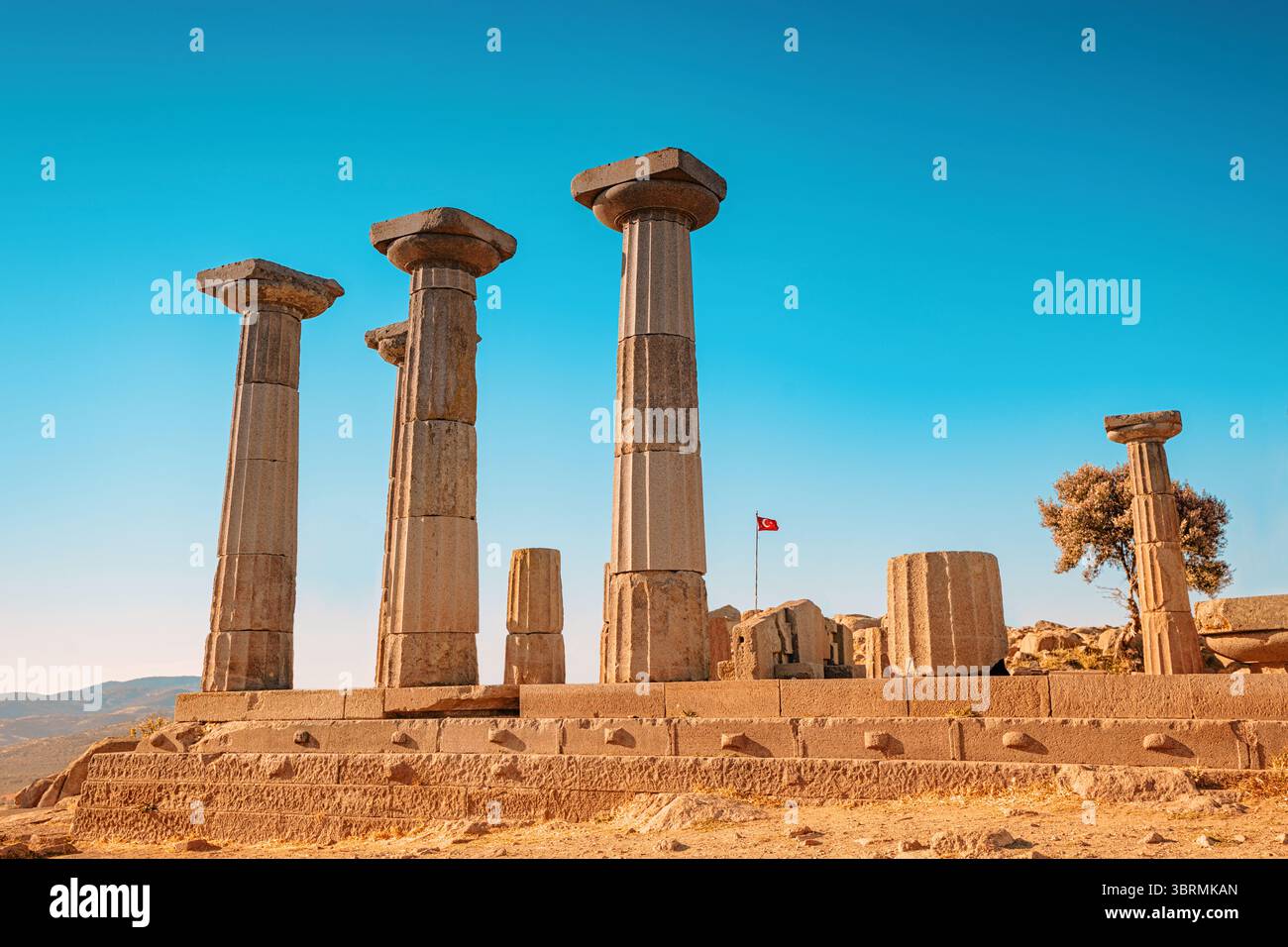 Ancient greek columns standing tall, with the turkish flag waving ...