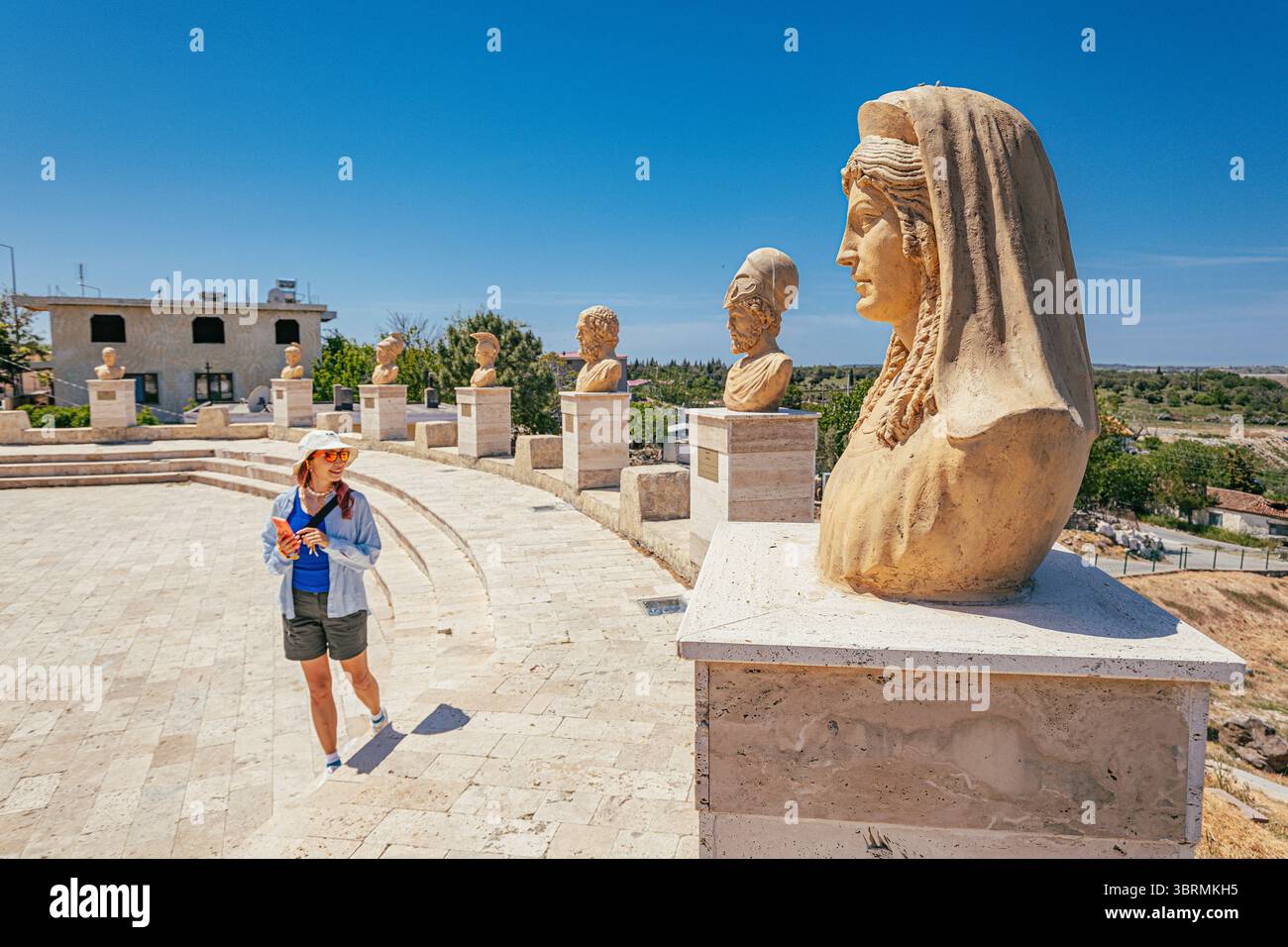 04 May 2025, Tevfikiye, Turkiye: Woman traveler exploring sculpted ...