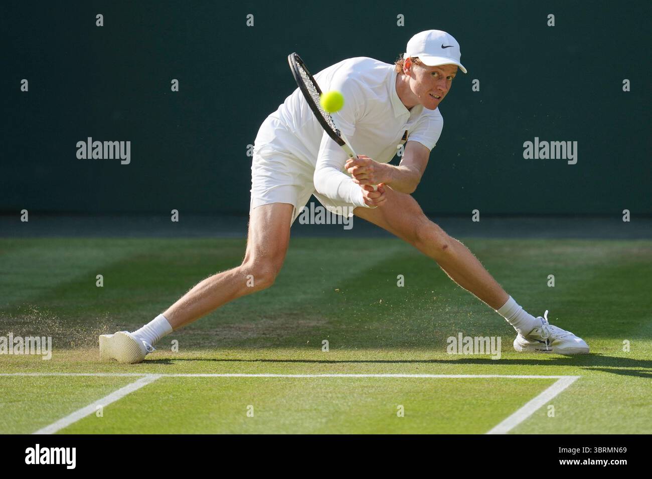 Italy's Jannik Sinner returns to Carlos Alcaraz of Spain in the men's ...