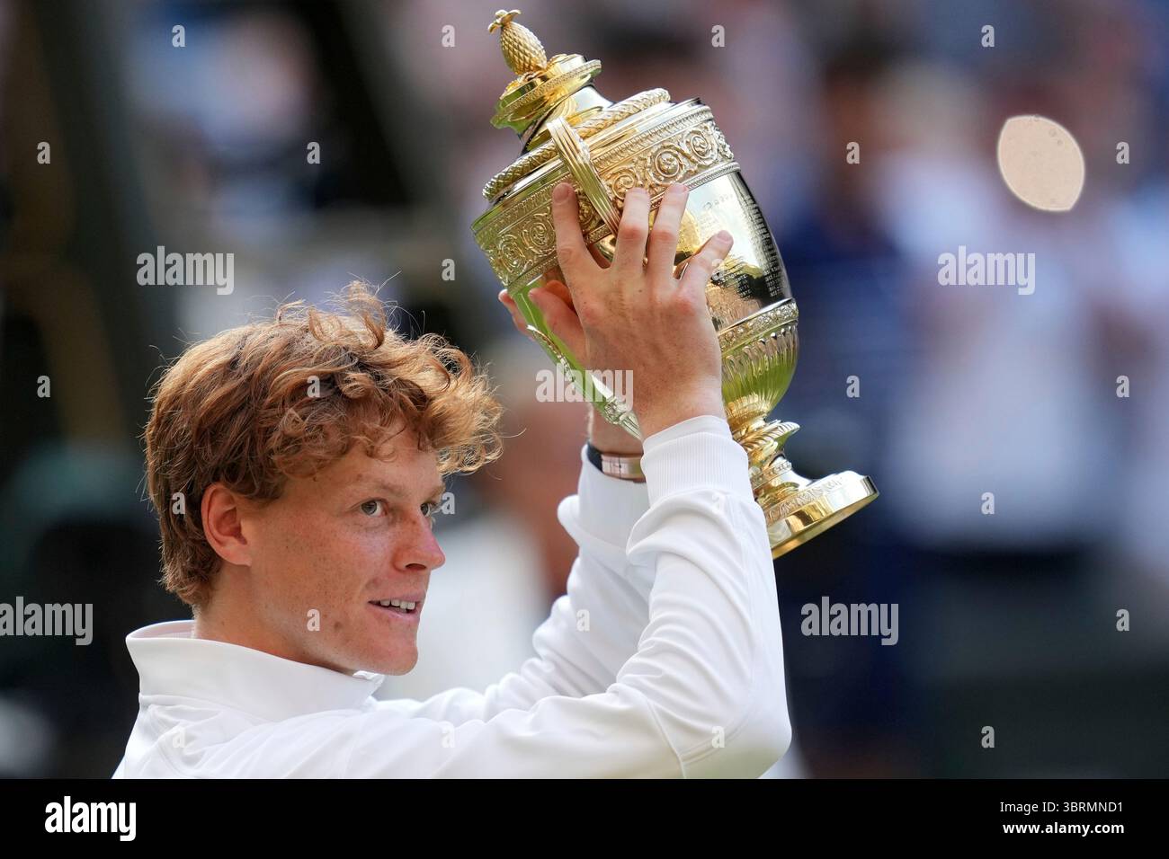 Italy's Jannik Sinner celebrates with the trophy after beating Carlos ...