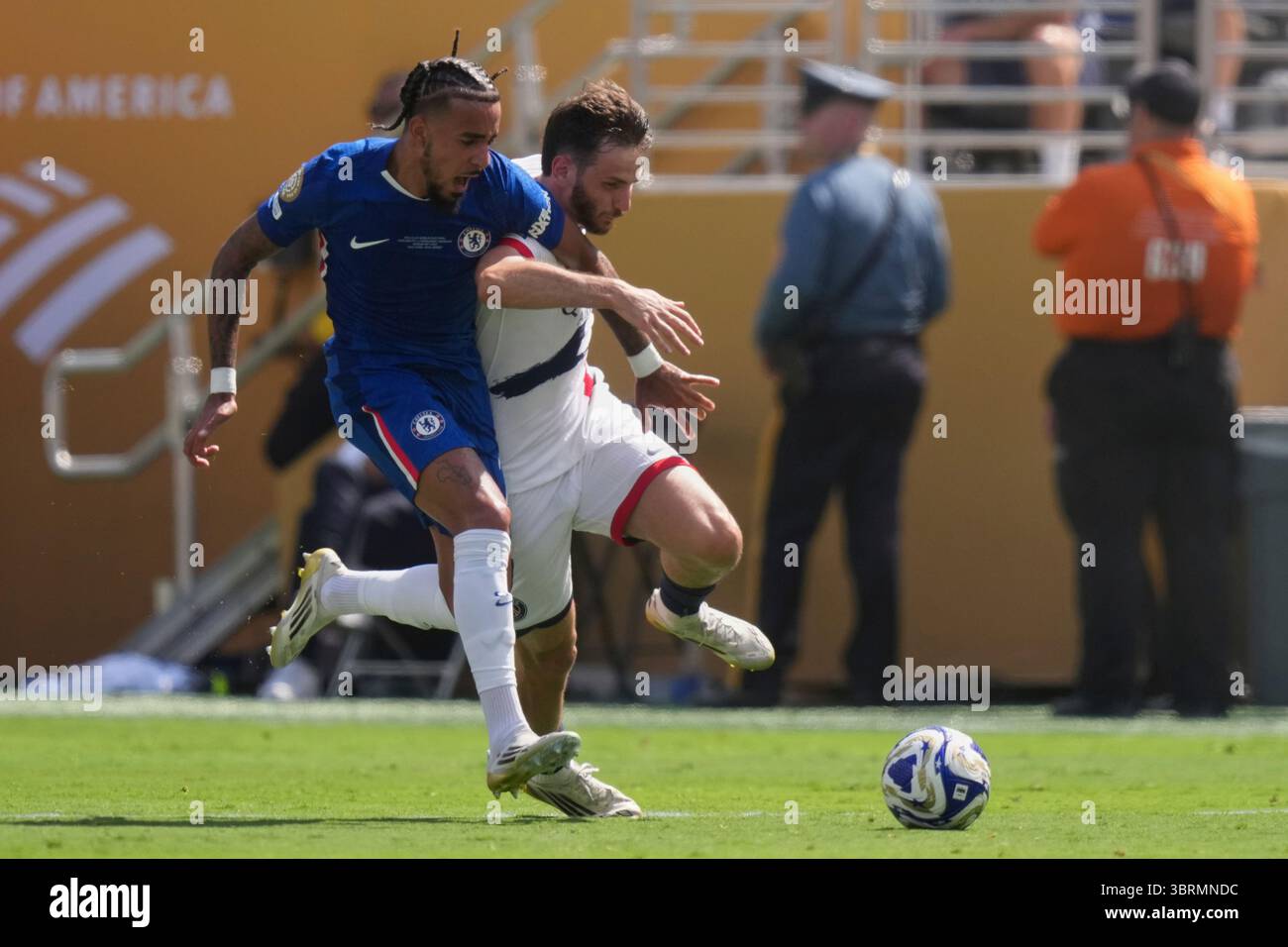 Chelsea's Malo Gusto, left, and Paris Saint-Germain's Khvicha ...