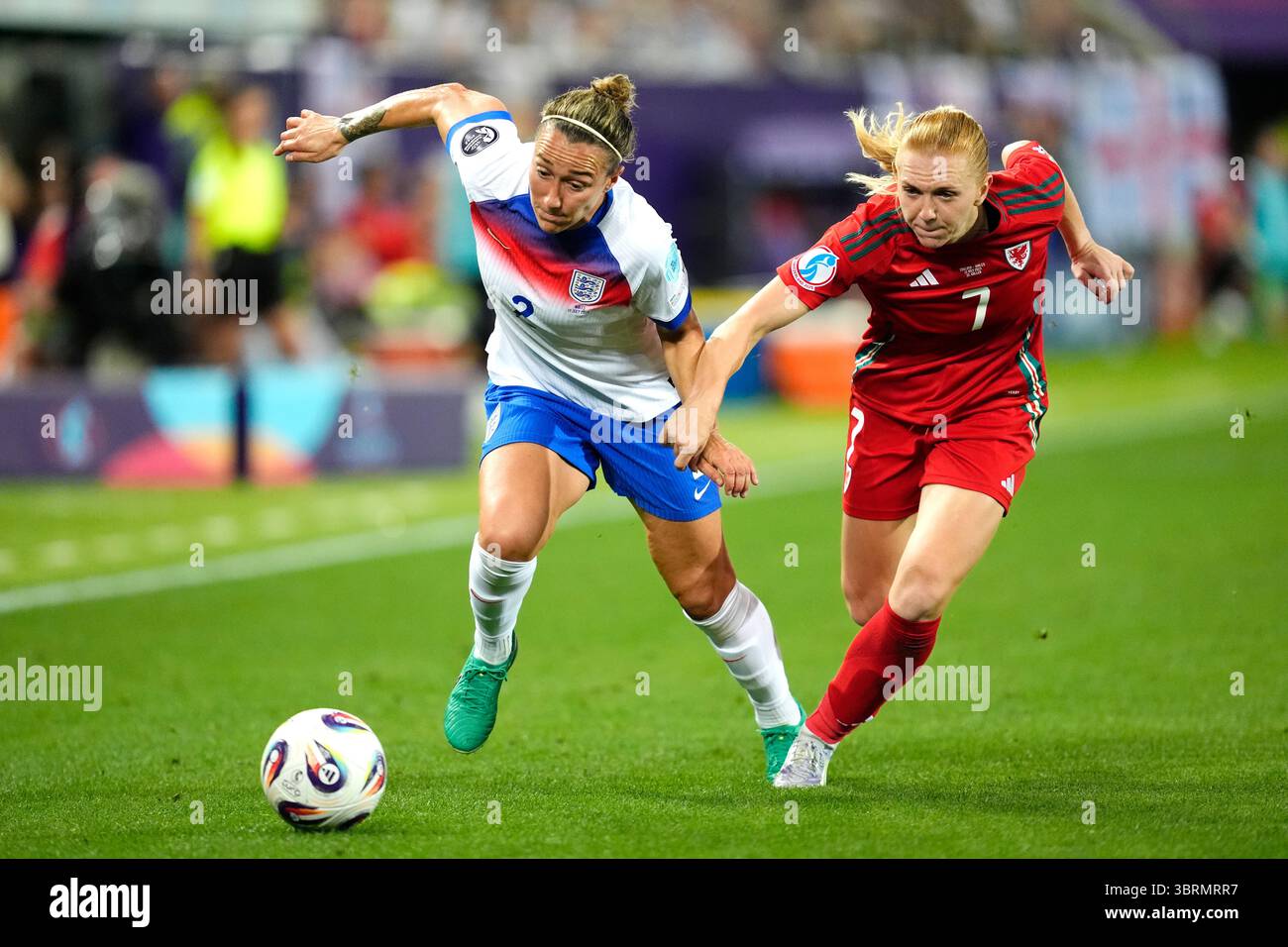 England's Lucy Bronze (left) and Wales' Ceri Holland battle for the ...