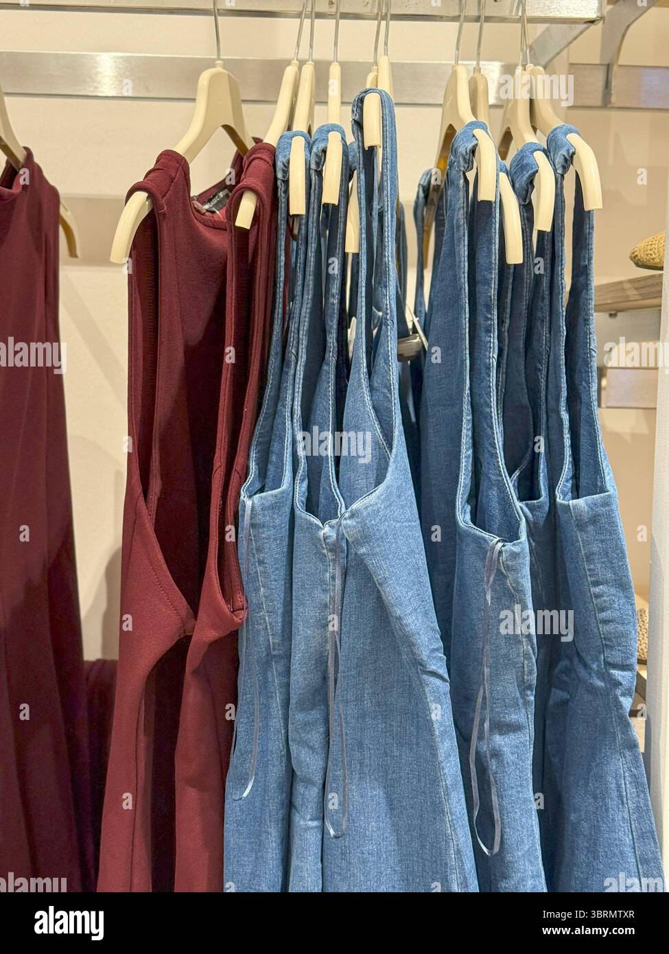 Denim Skirt Rack with Varying Washes and a Neutral Accent Stock Photo ...