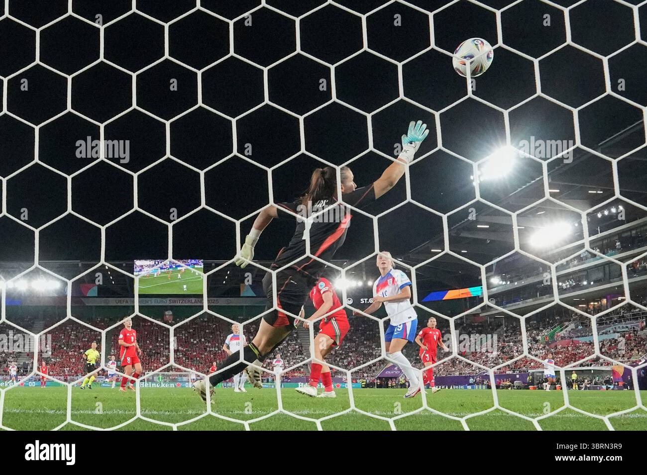 England's Aggie Beever-Jones, right, scores a goal past Wales ...