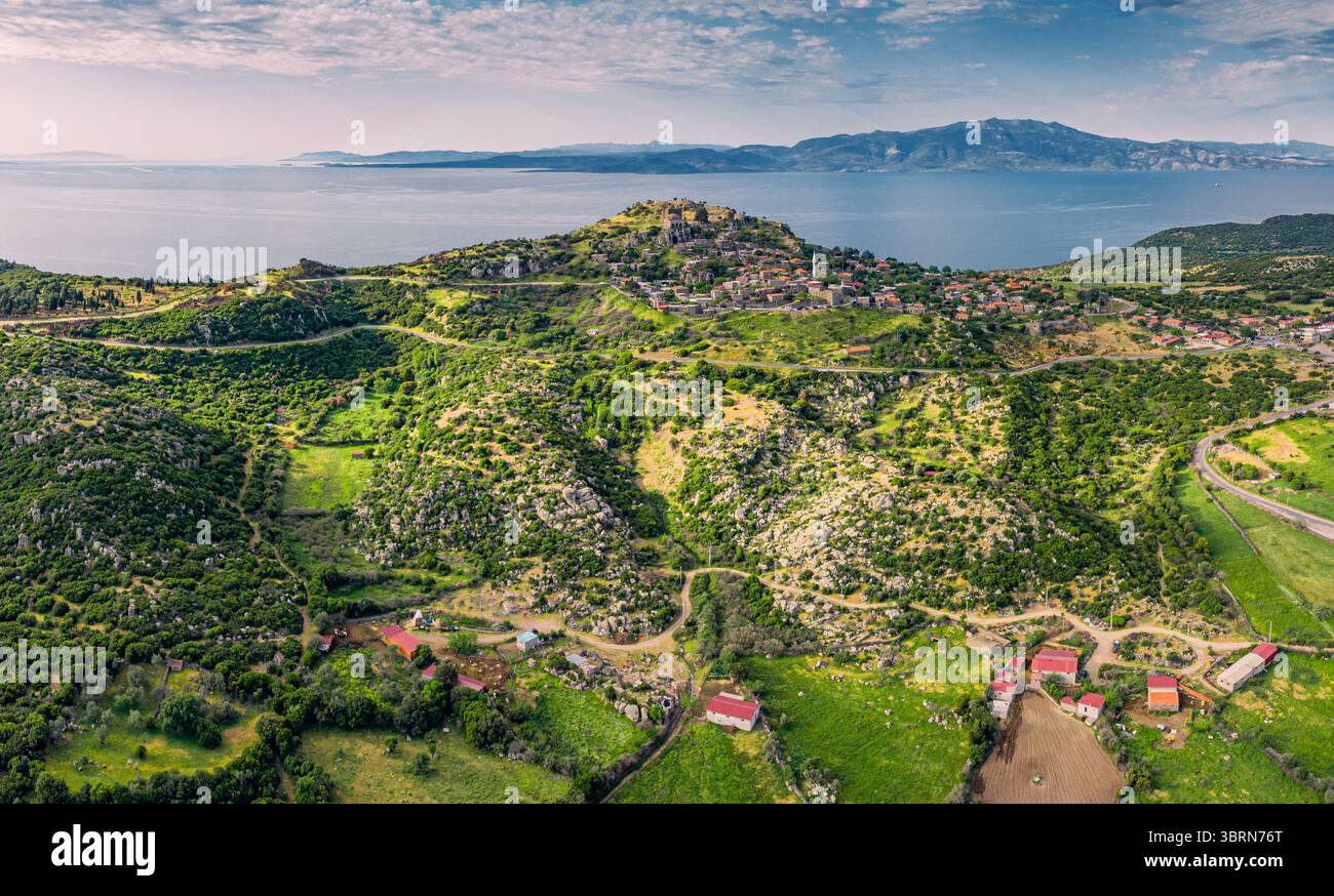 Aerial view of Assos ancient city with its Temple of Athena ruins on ...