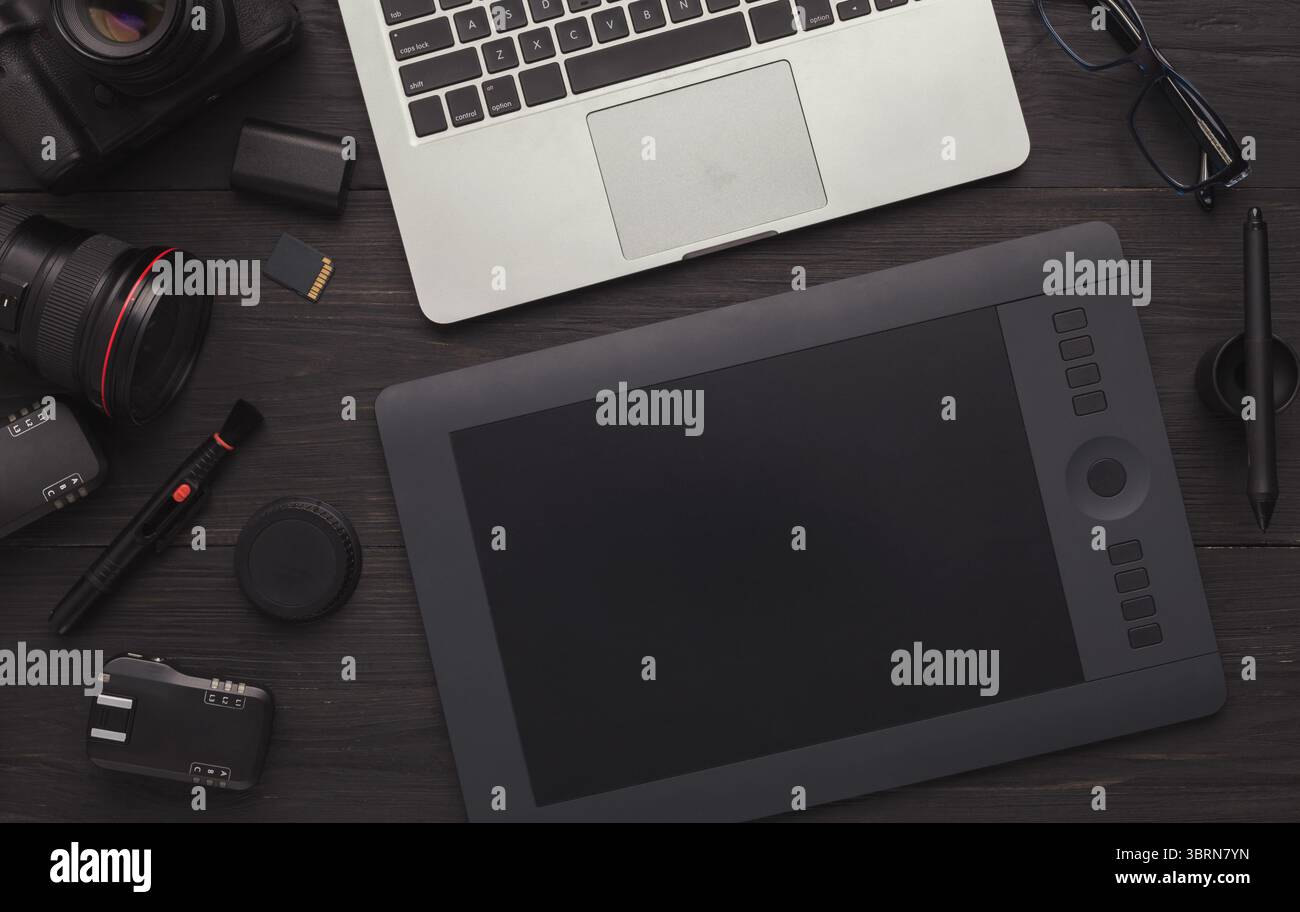 Designer workplace with graphic tablet and laptop Stock Photo - Alamy