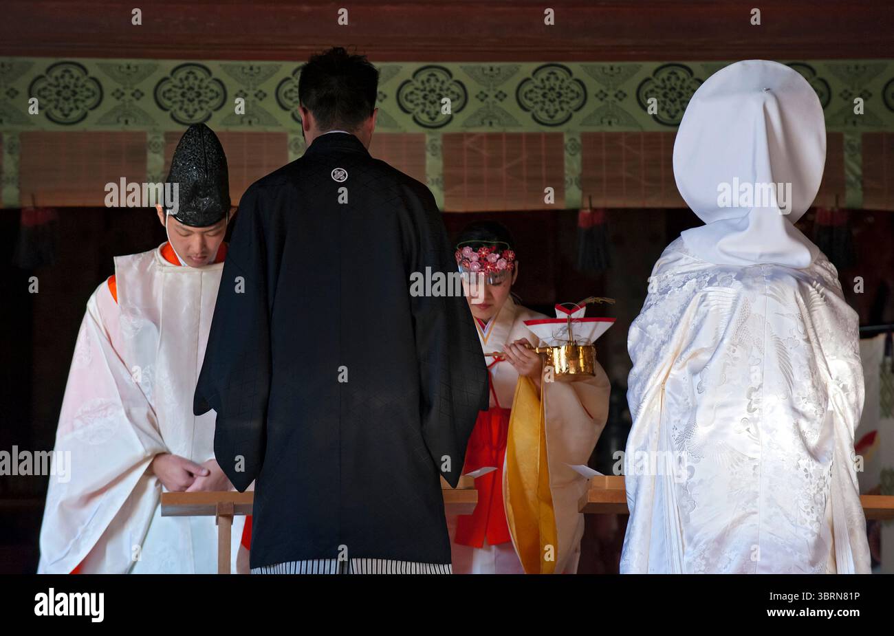 Japanese couple in traditional wedding kimono during a Shinto ceremony ...