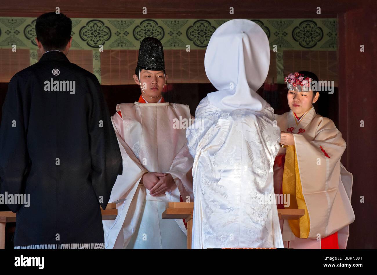 Japanese couple in traditional wedding kimono during a Shinto ceremony ...