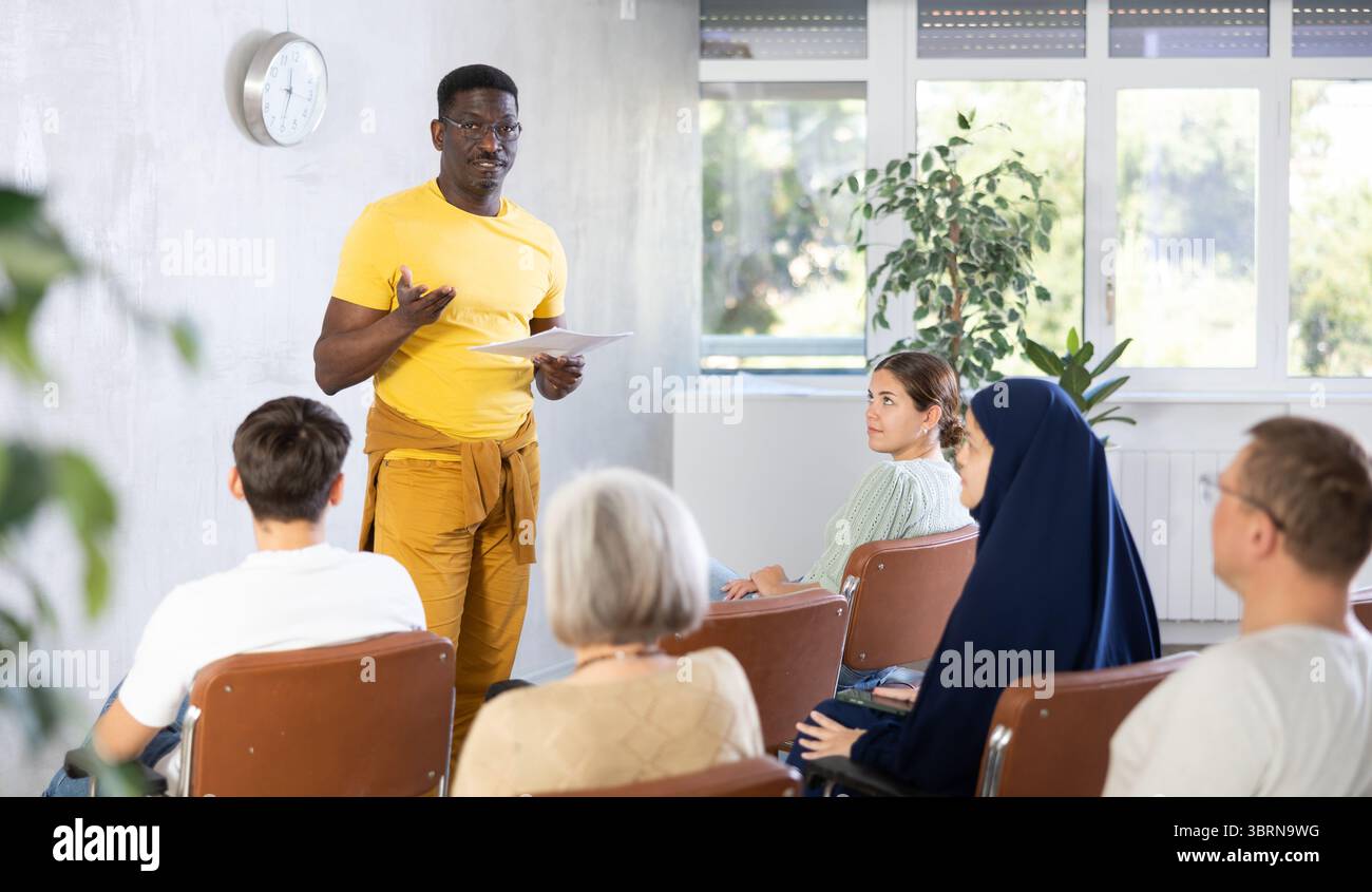 African american male teacher lecturing to students at auditorium Stock ...
