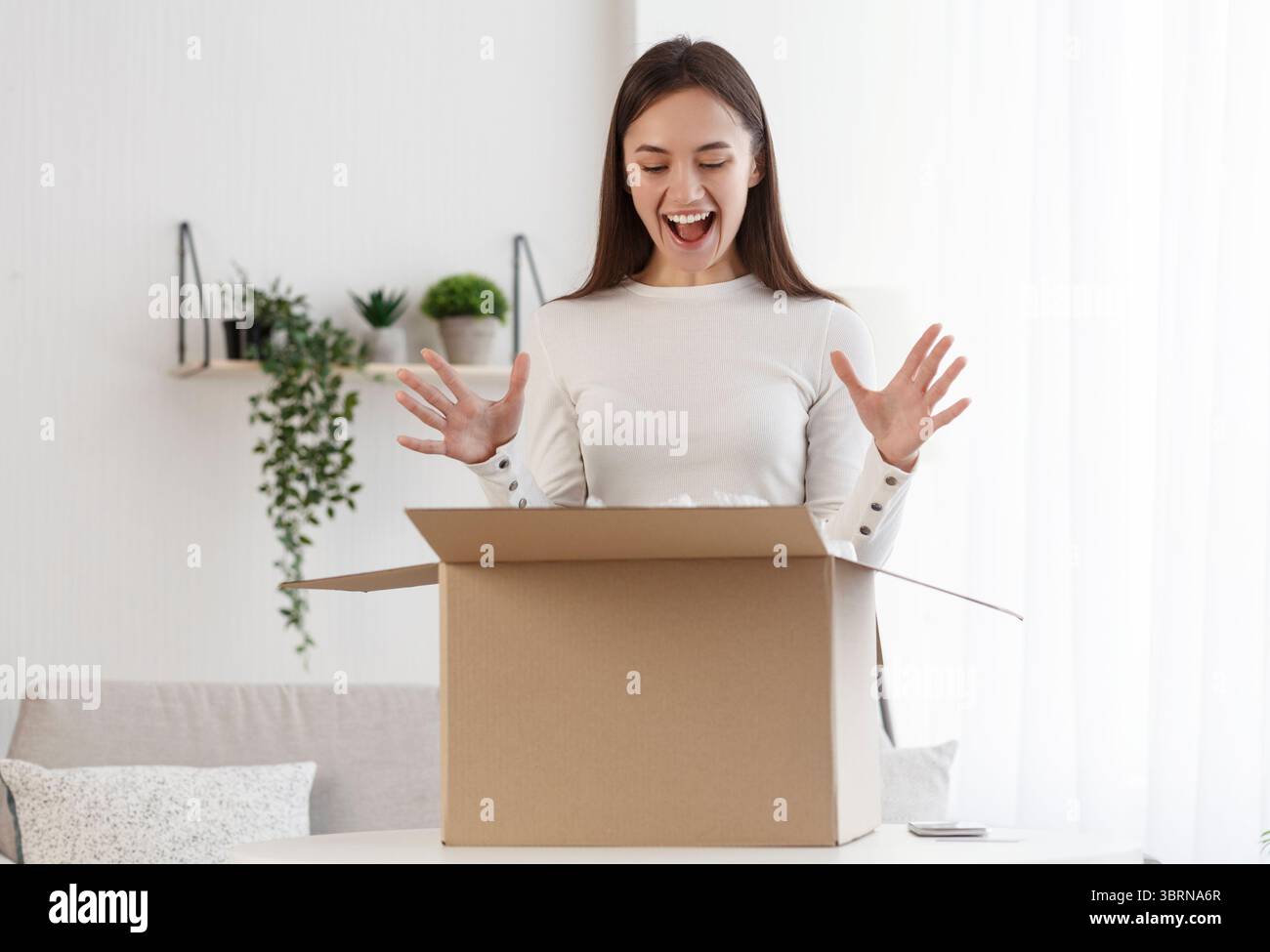 Satisfied young female client hi-res stock photography and images - Alamy