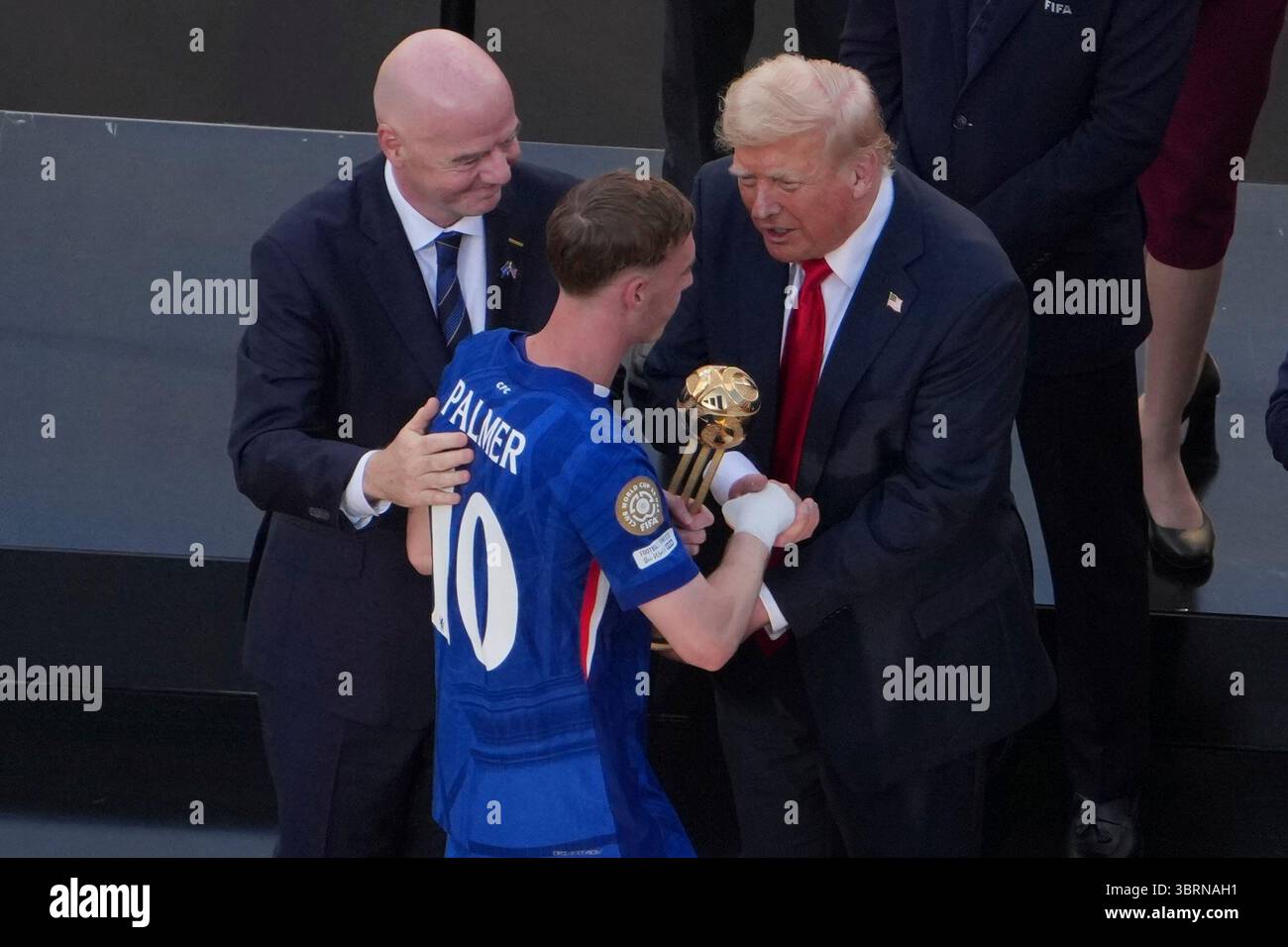 Chelsea's Cole Palmer (10) receives the Golden Ball award from ...
